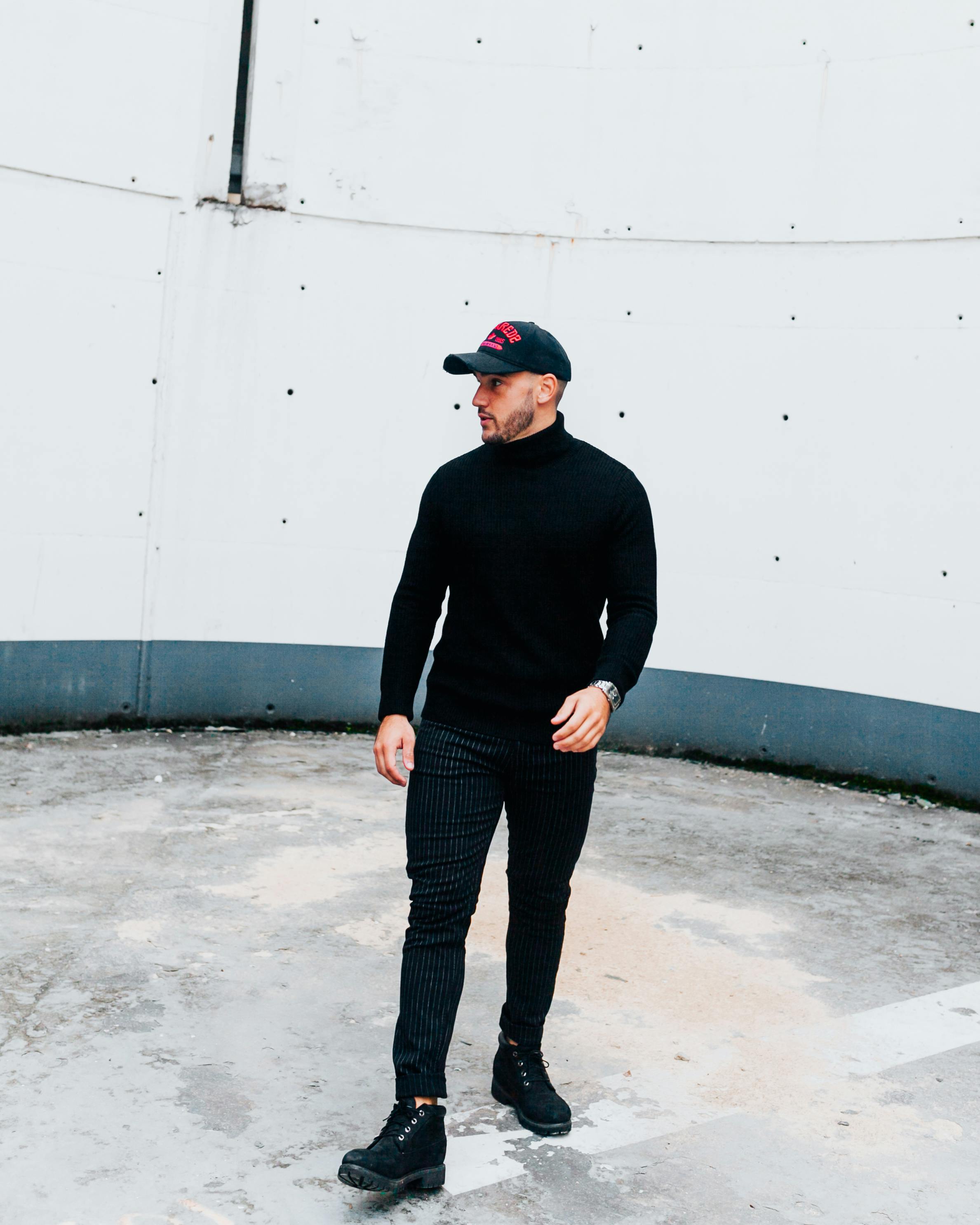 Bearded Man in Black Outfit Wearing Baseball Cap · Free Stock Photo