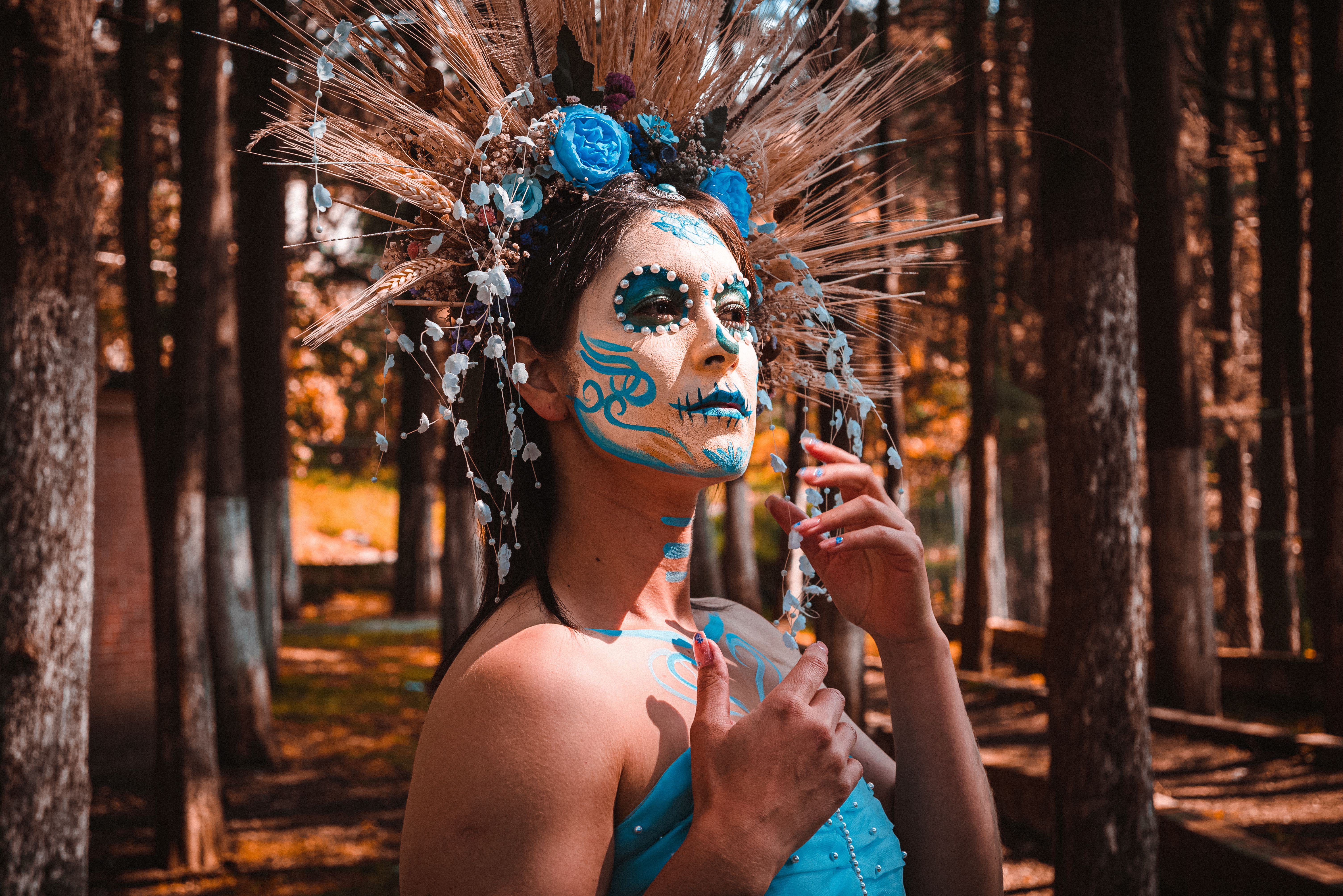 Woman with Painted Face in Forest · Free Stock Photo