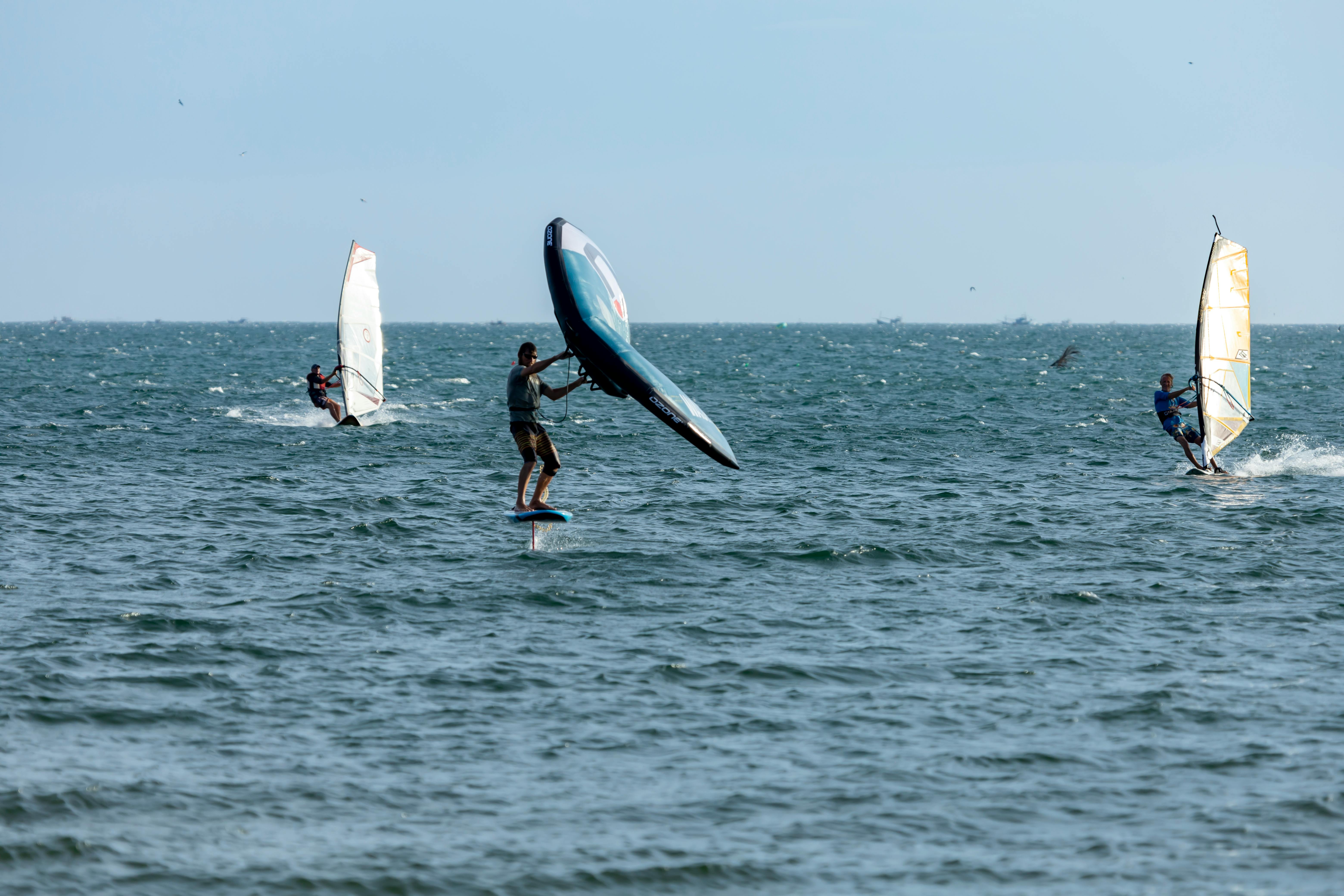 Photo of People Wing Foiling on a Sea · Free Stock Photo