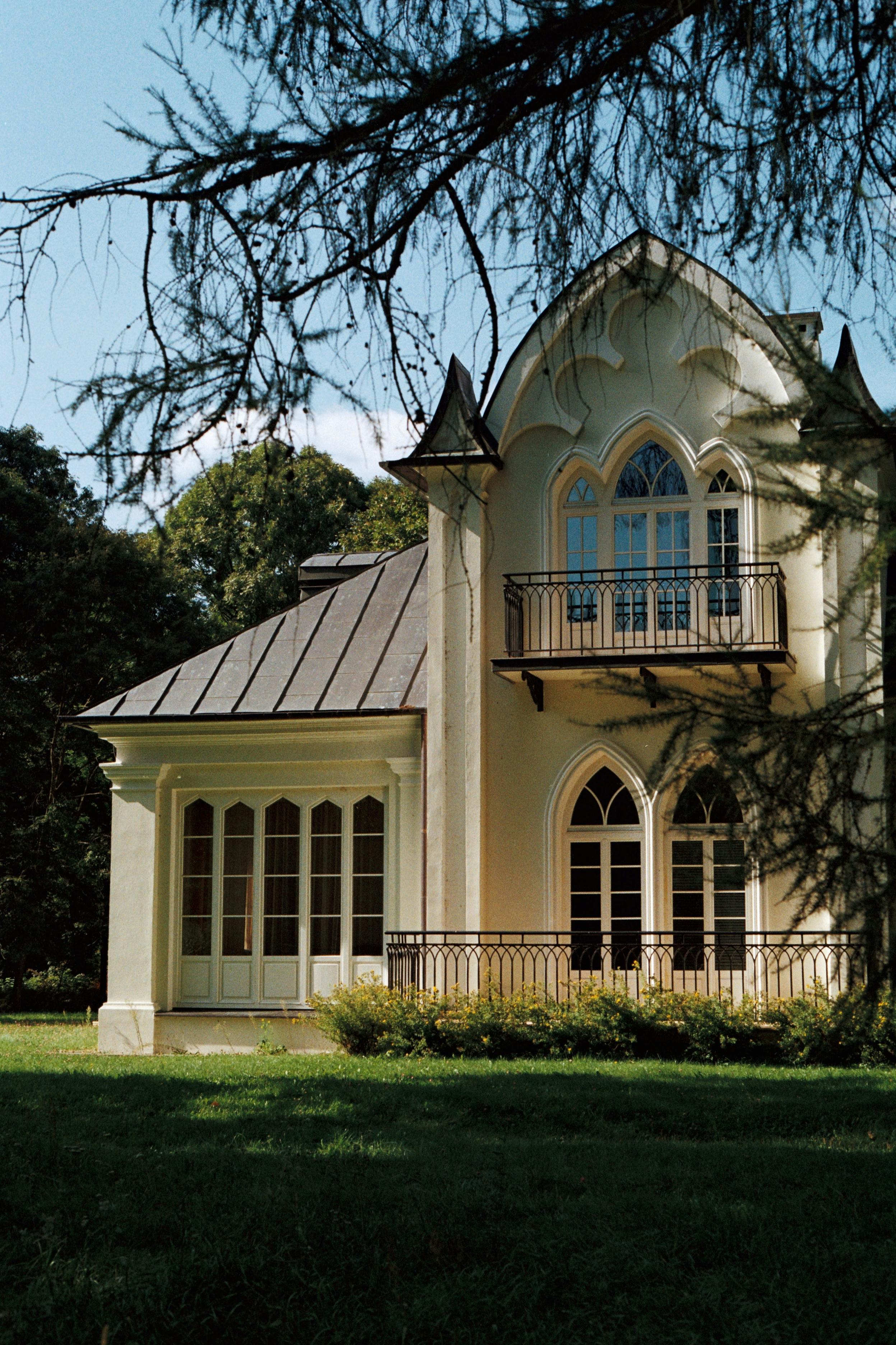 Brown and White Concrete Building Near Trees · Free Stock Photo