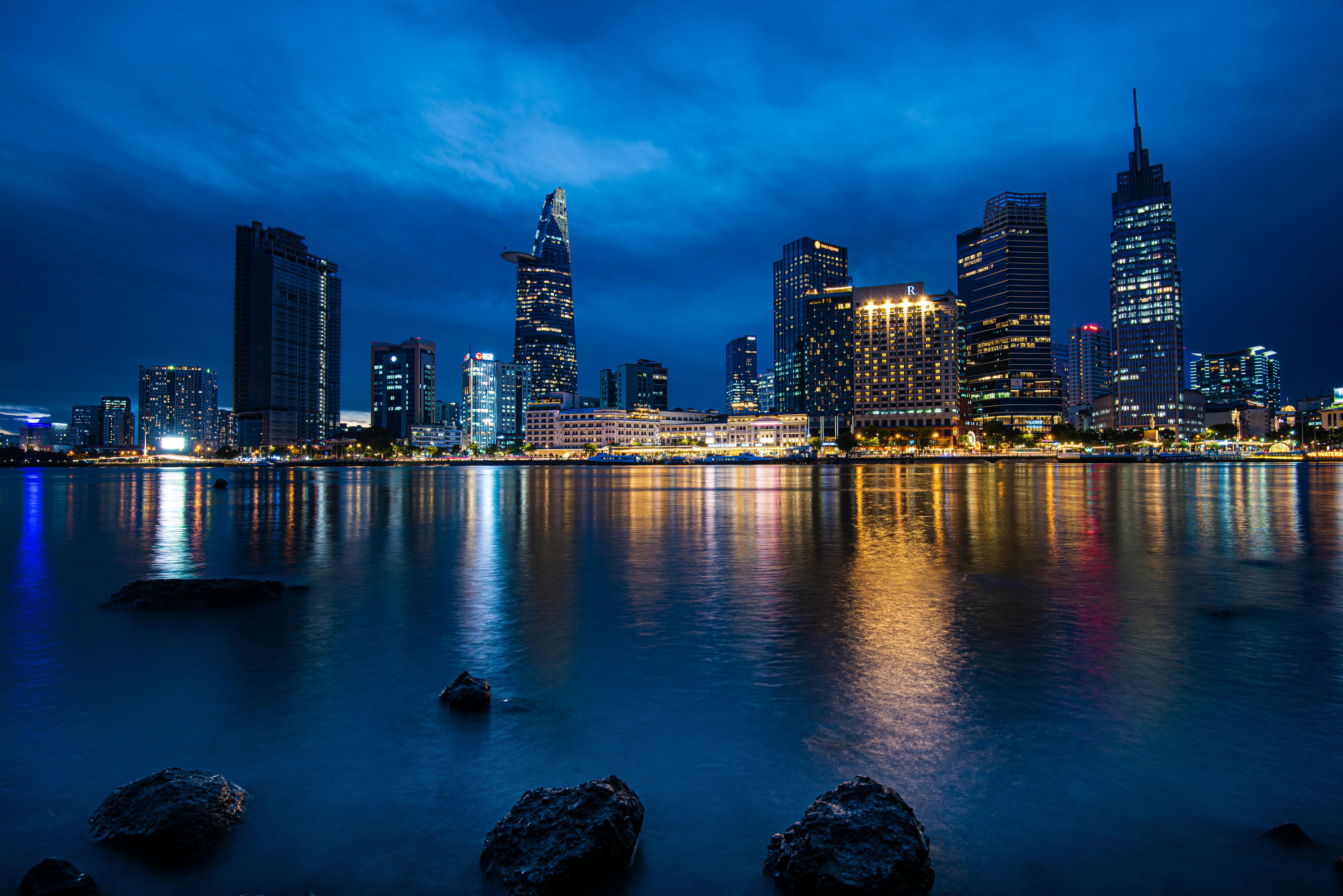A City Buildings Near the Saigon River at Night · Free Stock Photo