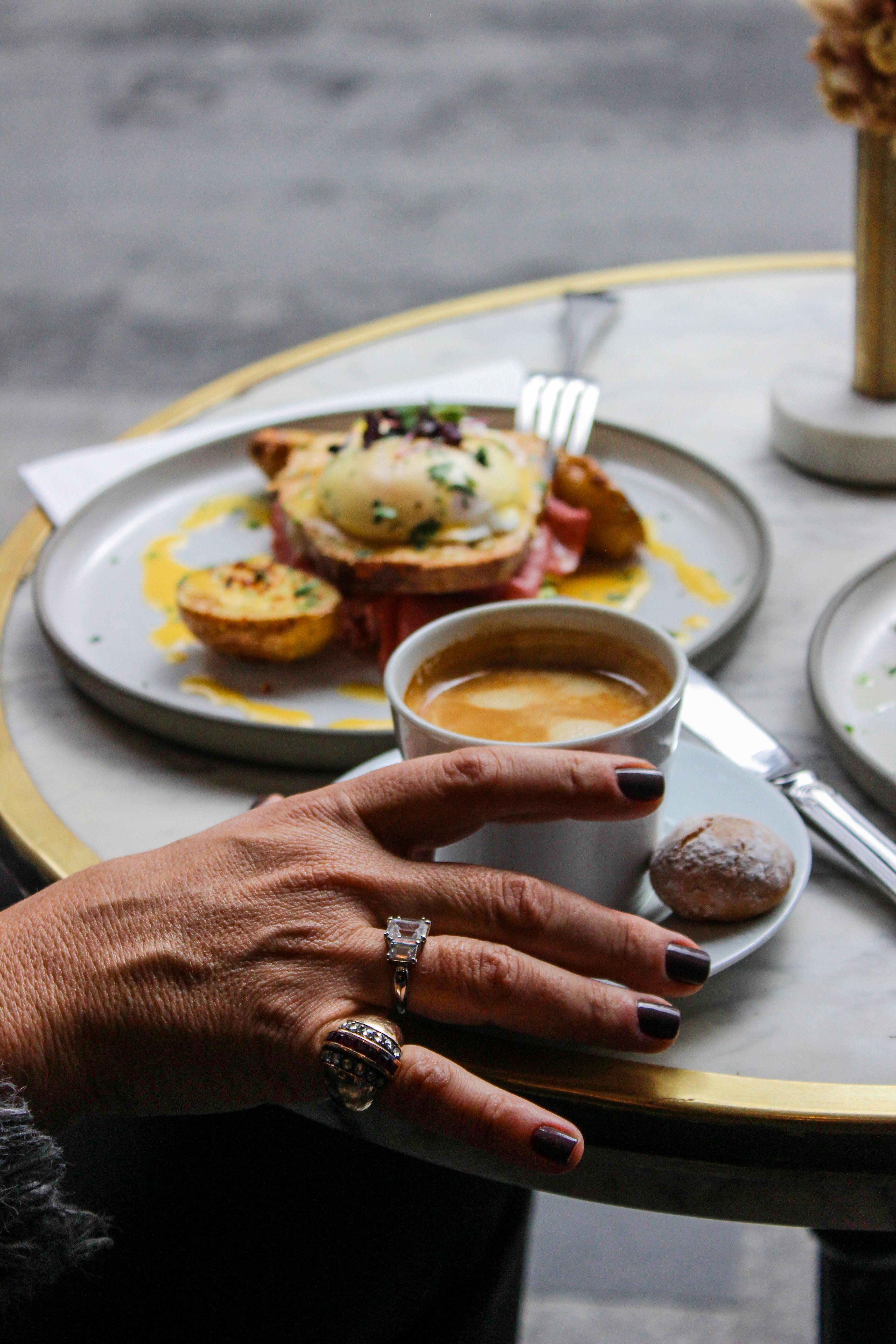 Woman Drinking Coffee and Eating French Breakfast · Free Stock Photo