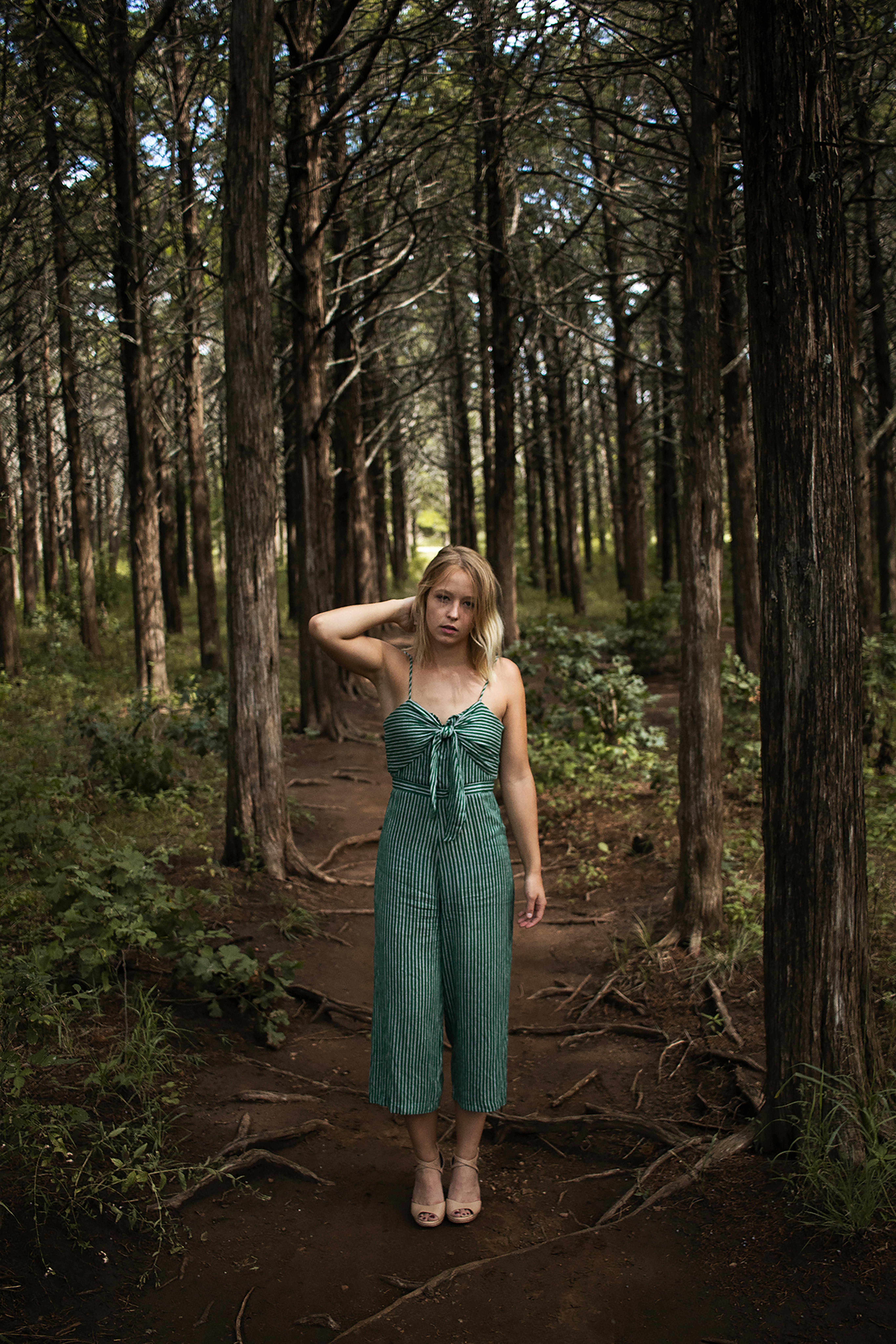 Woman Standing in the Middle of a Forest · Free Stock Photo