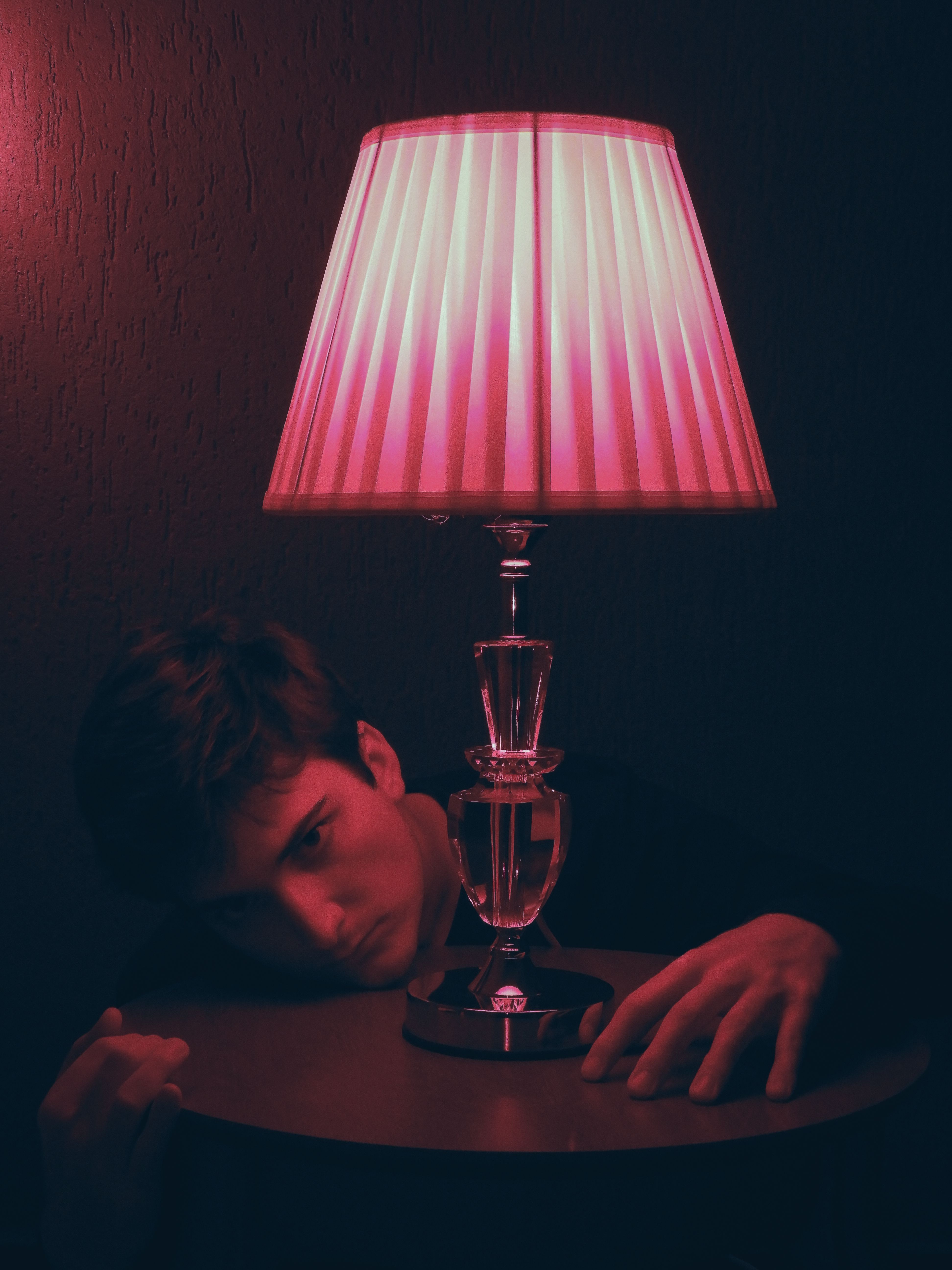 Photo of a Man with a Pink Lamp · Free Stock Photo