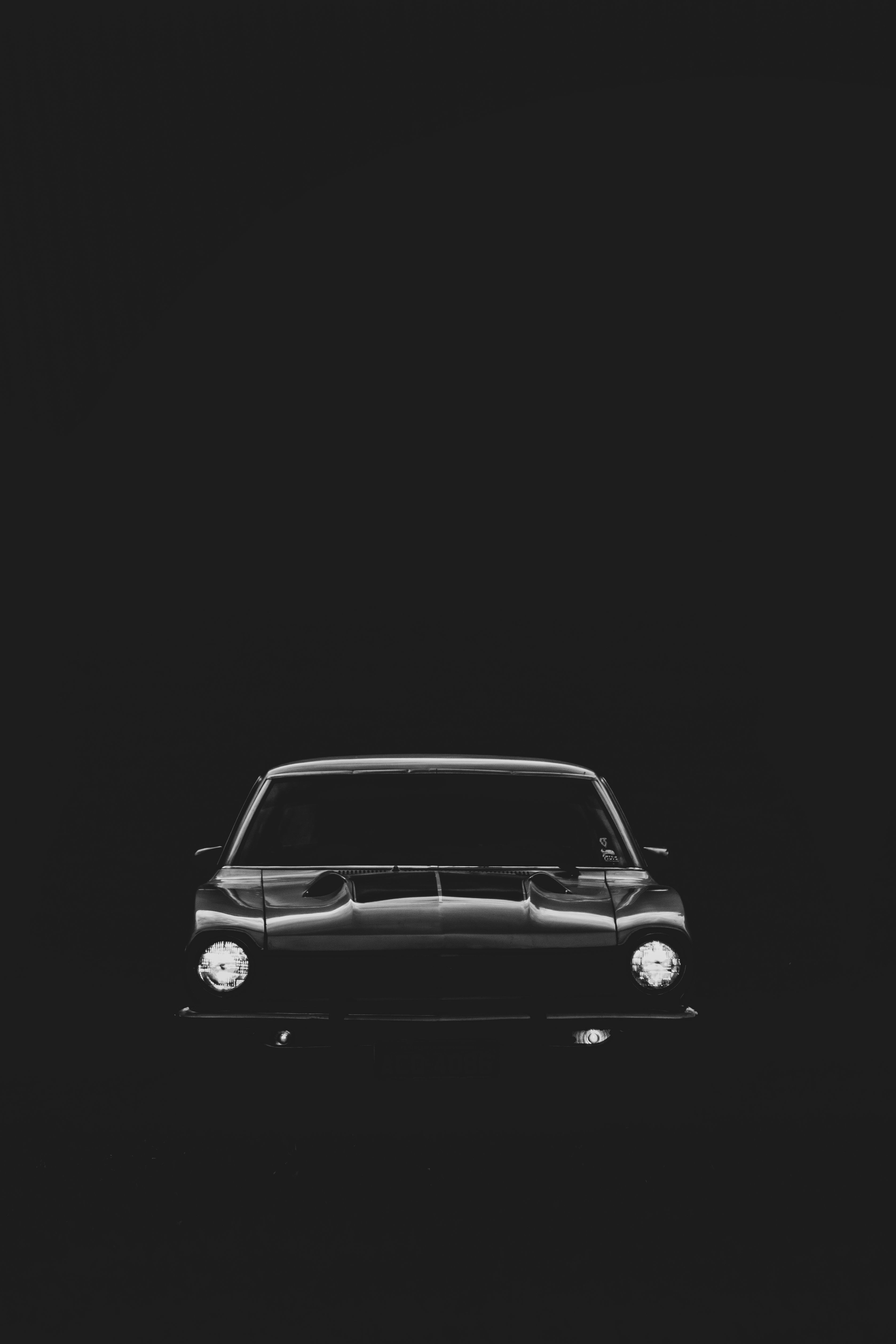 A Black Classic Car on Dark Background · Free Stock Photo