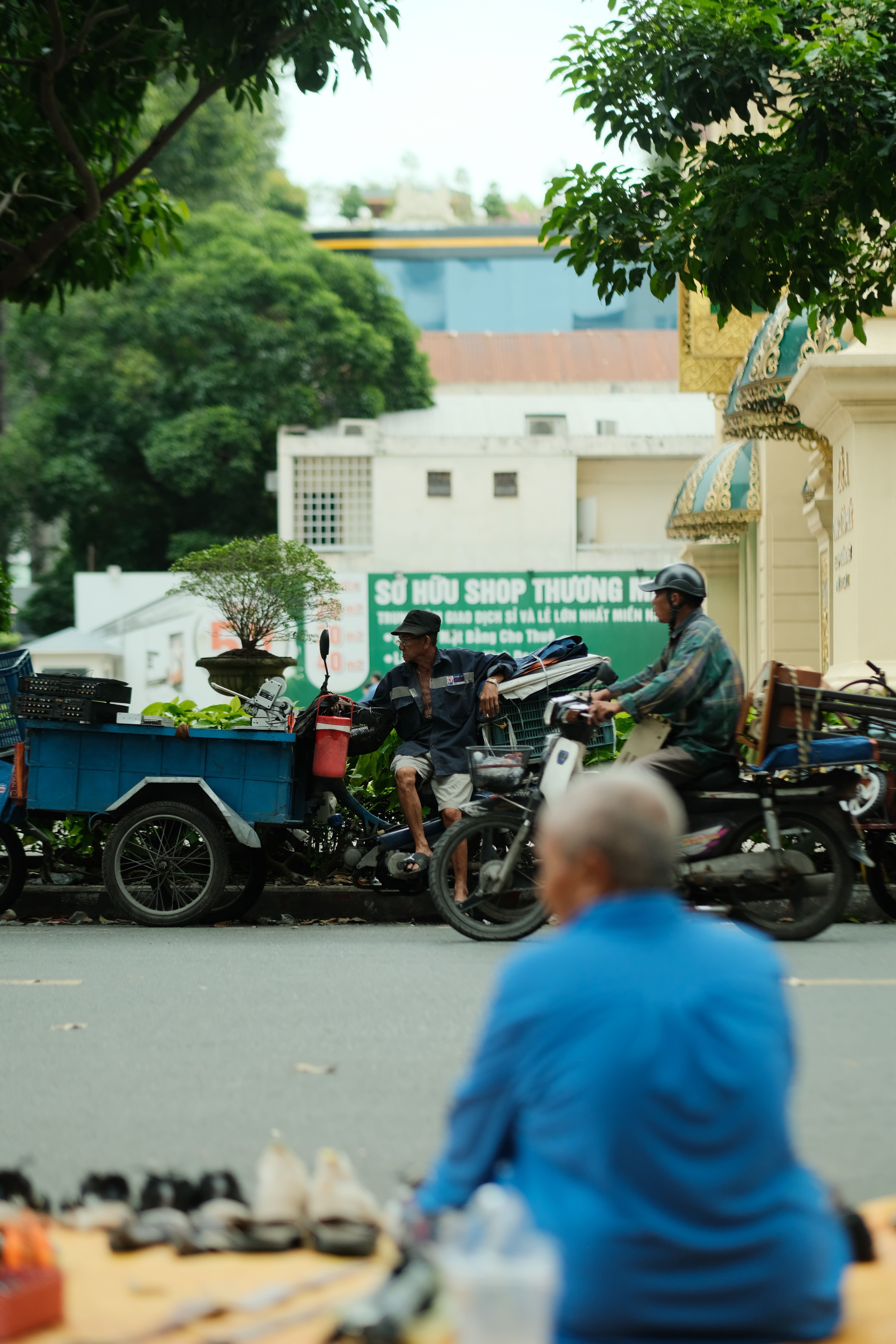 A Person Standing Beside a Motorcycle Carrying Loads of Flowers · Free ...