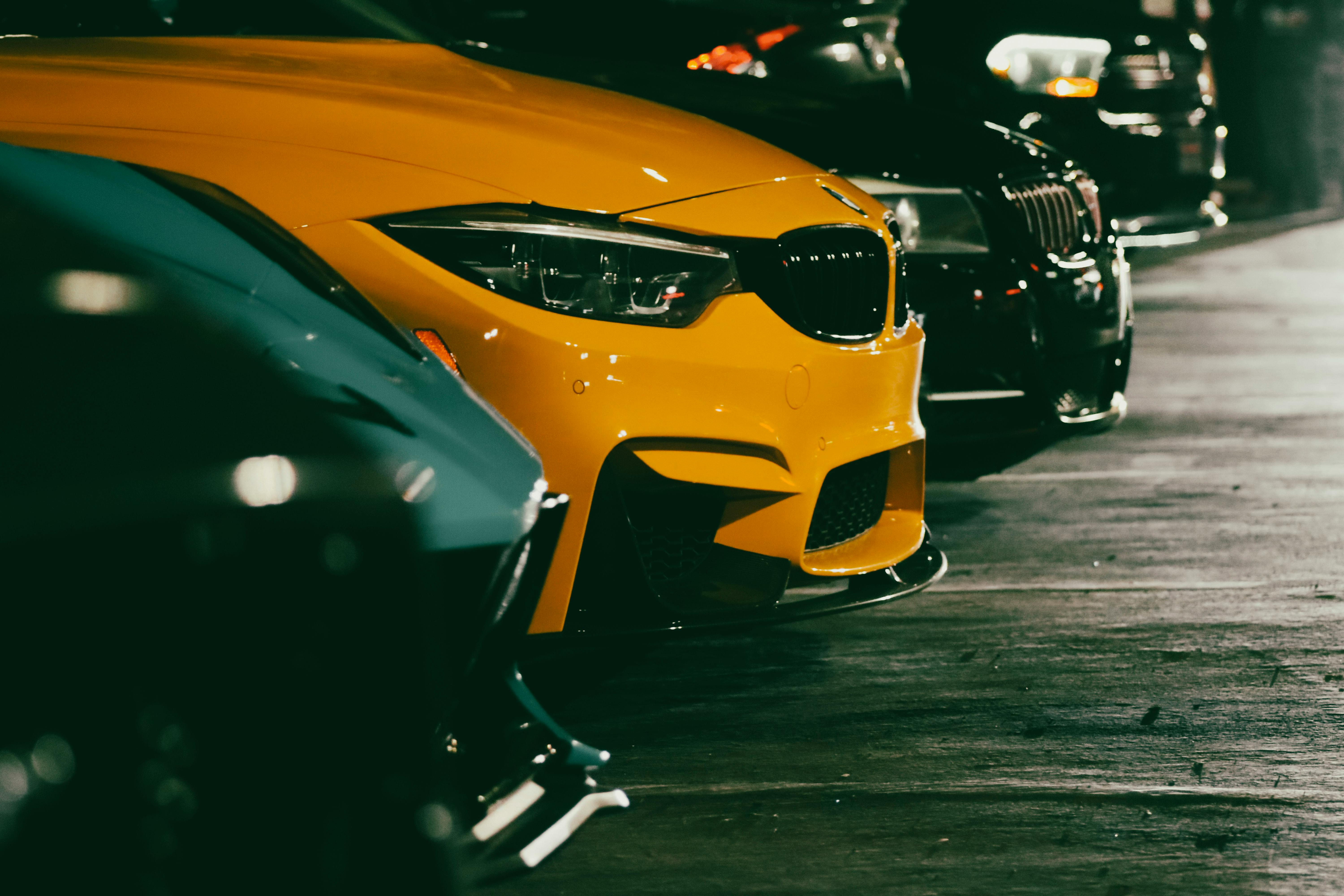 Close-Up Shot of Sports Cars in the Parking Area · Free Stock Photo