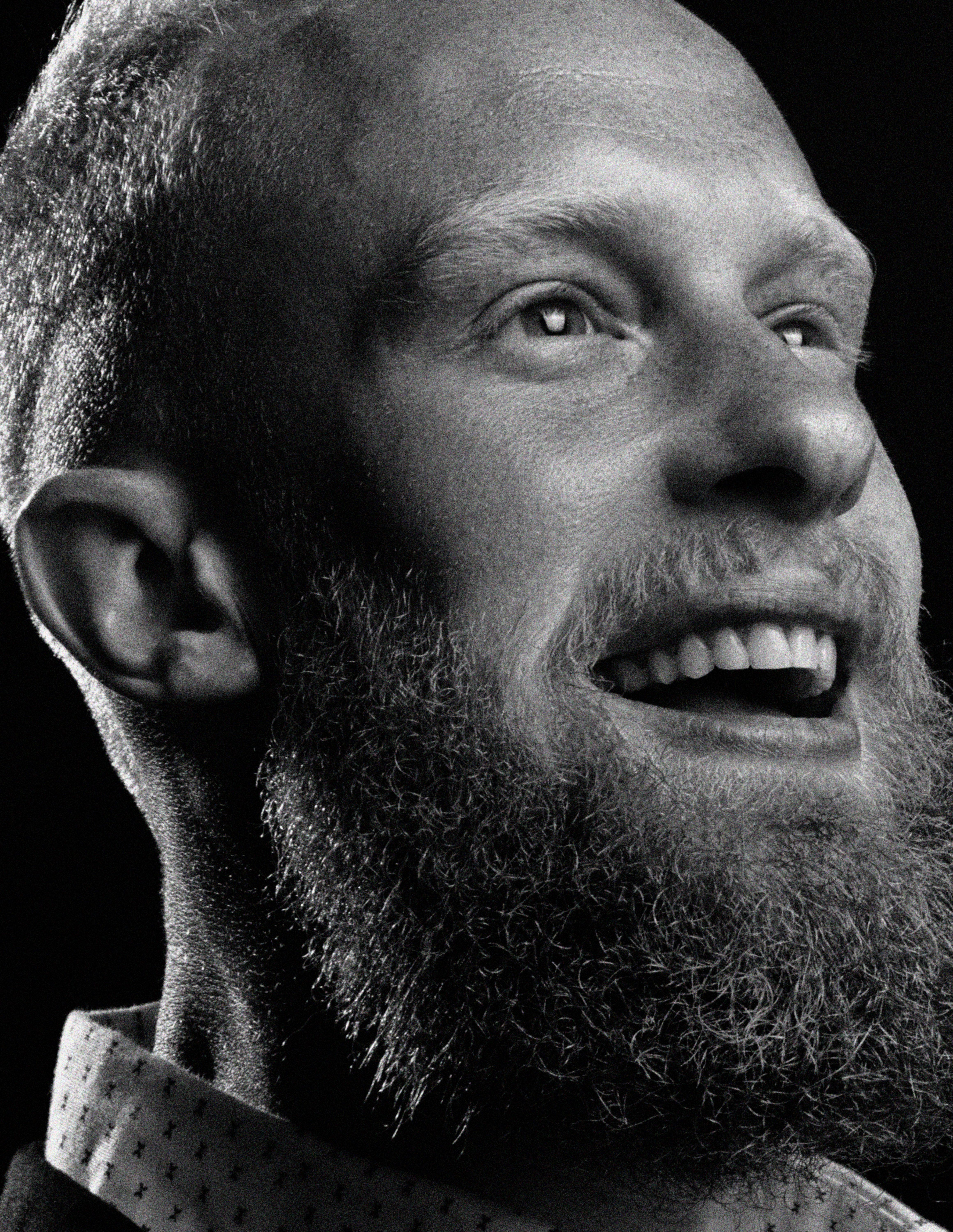 Grayscale Photo of a Man Smiling · Free Stock Photo