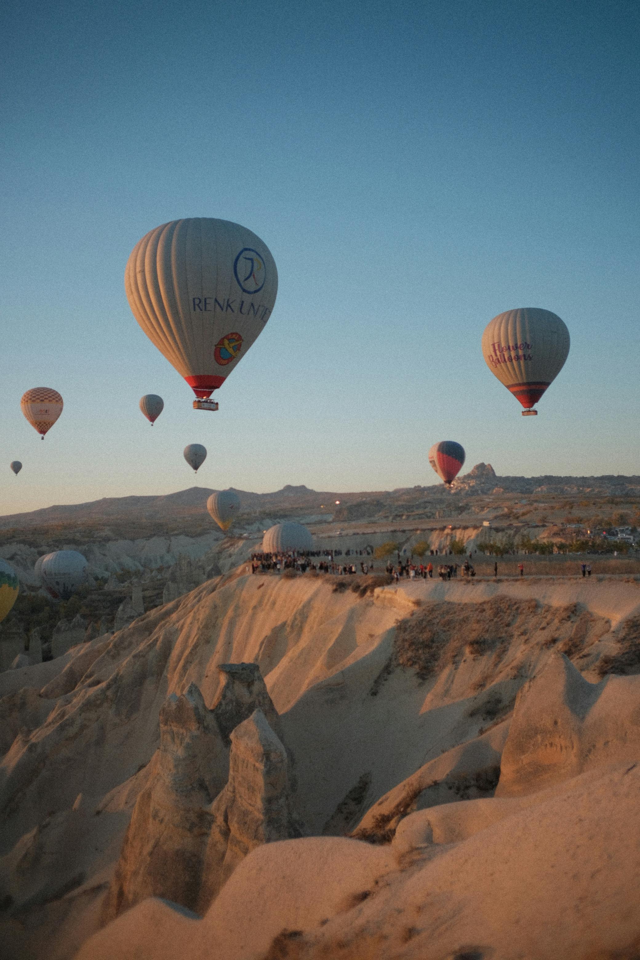 Hot Air Balloons over Rocky Landscape in Cappadocia · Free Stock Photo