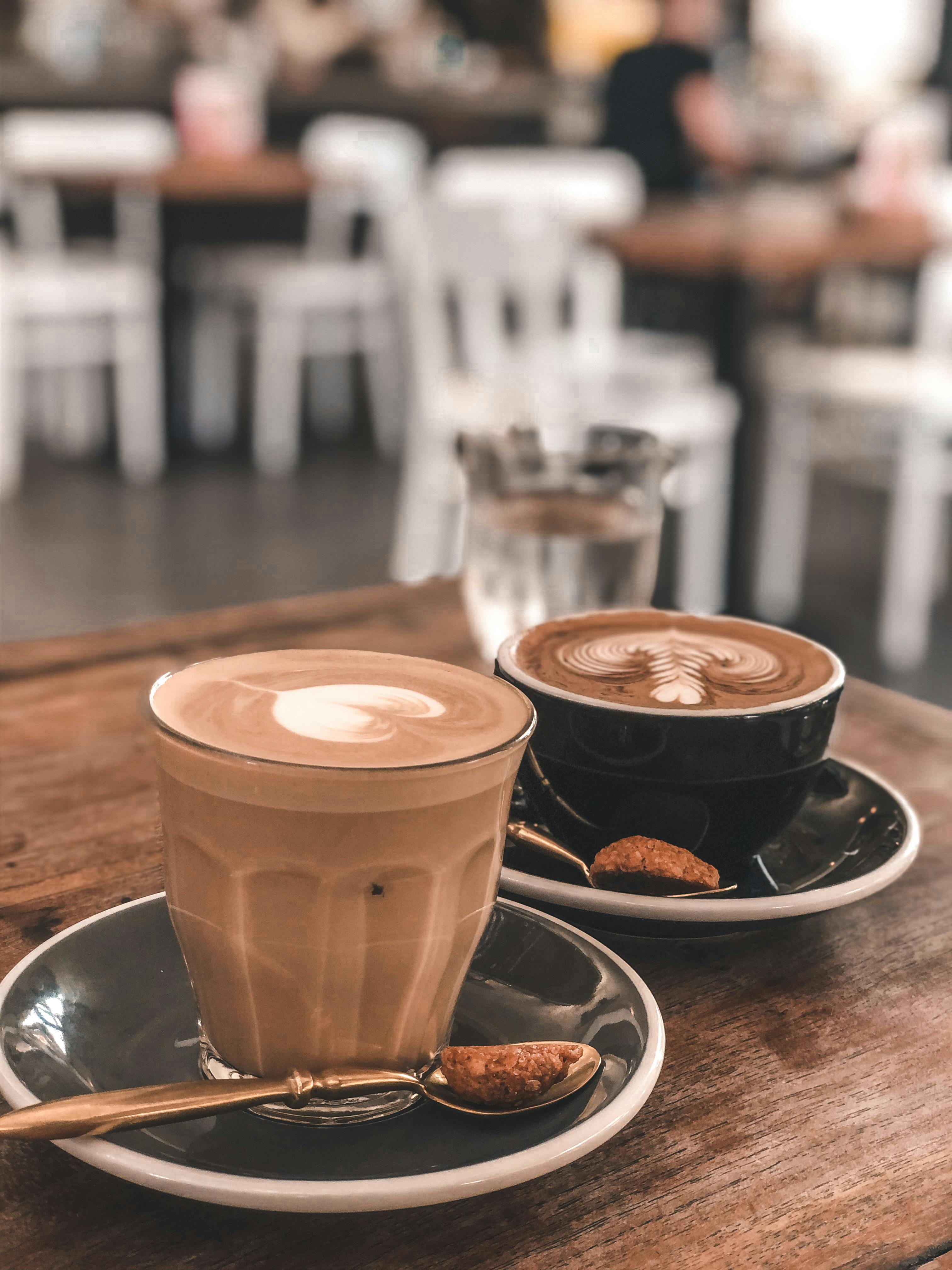 Cup of delicious coffee with froth on breakfast in cafeteria · Free ...