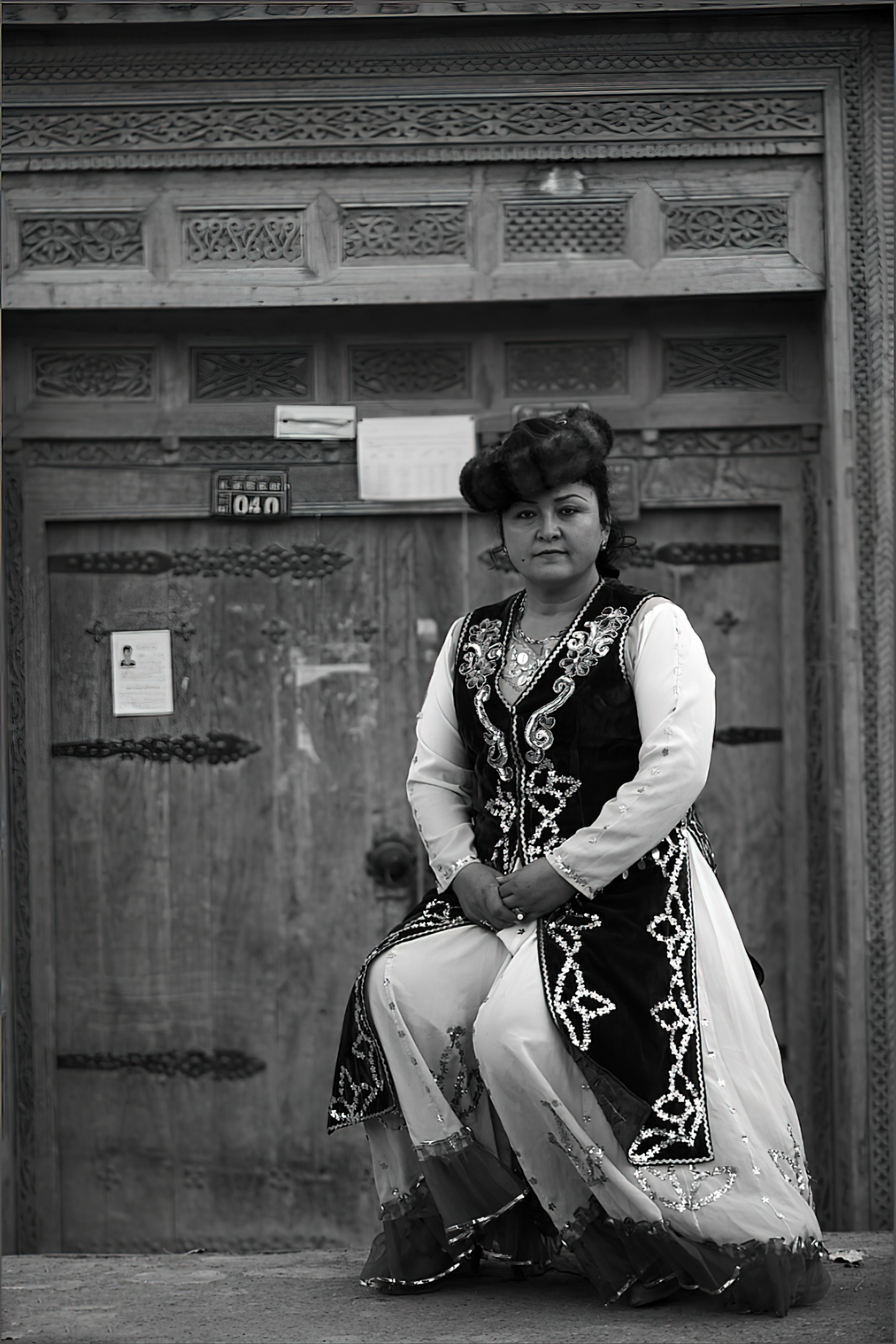 Woman in White Long Sleeve Dress Sitting on Black Metal Gate · Free ...
