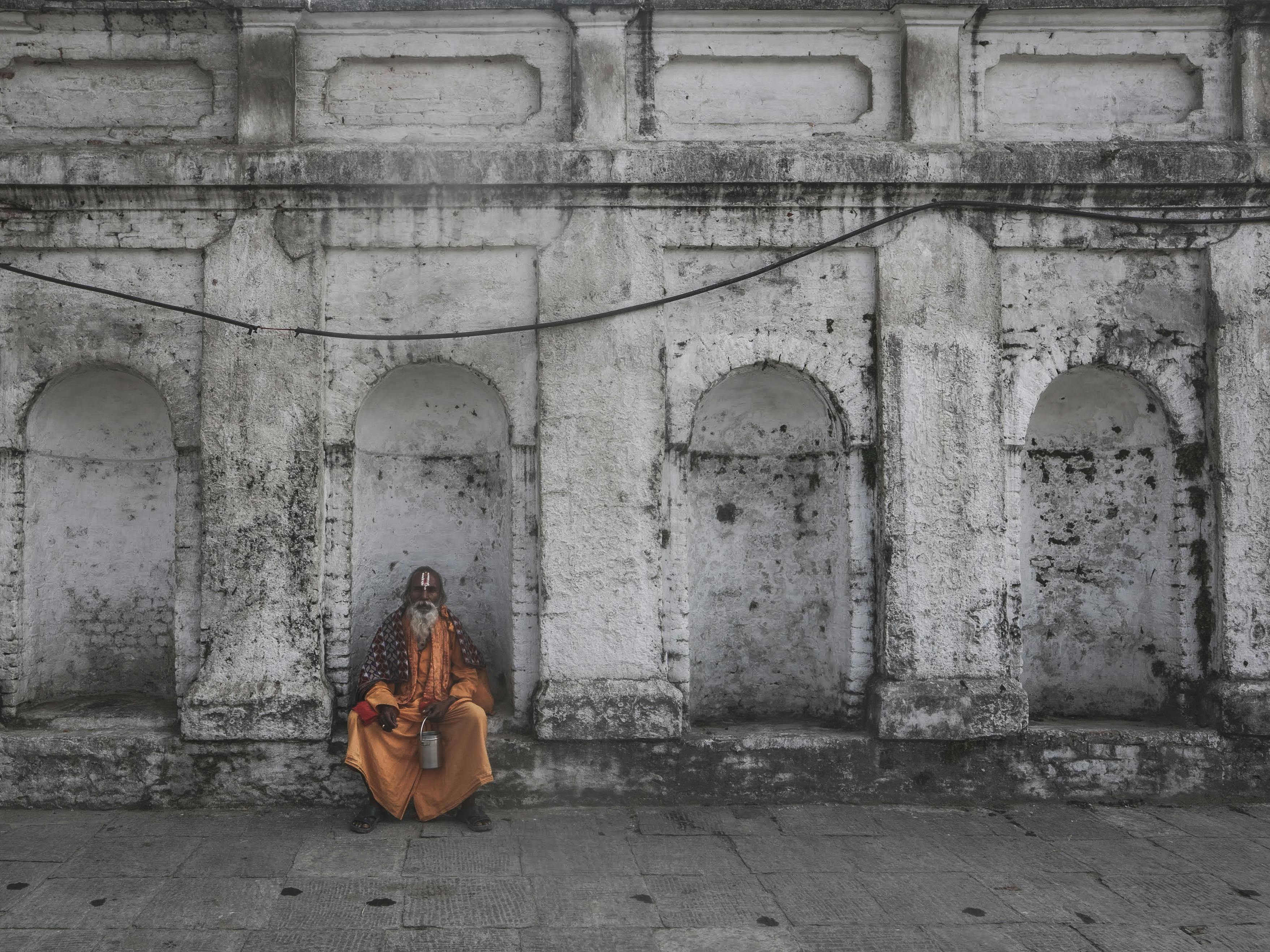 A Sadhu Sitting on the Sidewalk · Free Stock Photo