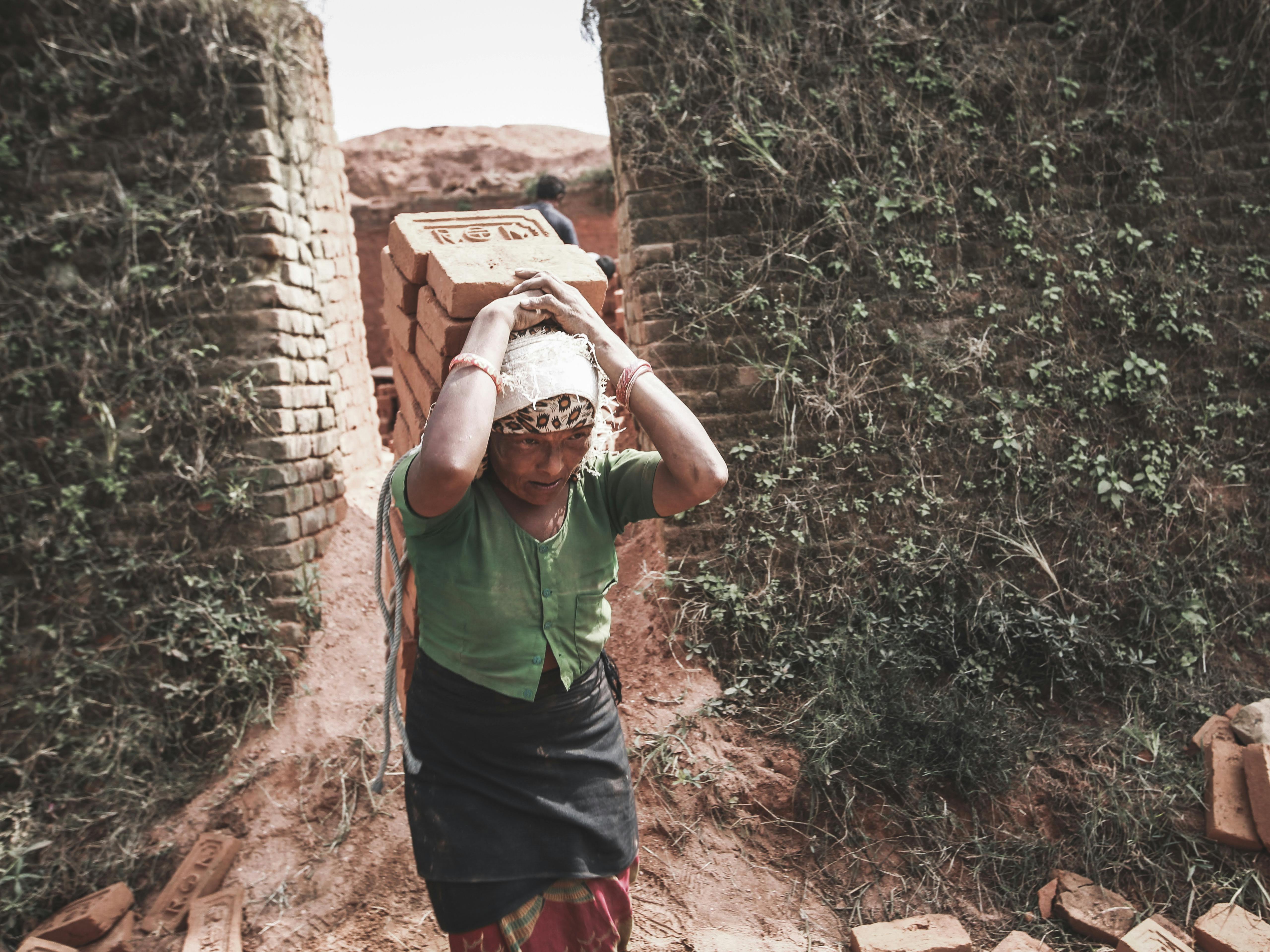 A Woman Using Wheelbarrow · Free Stock Photo