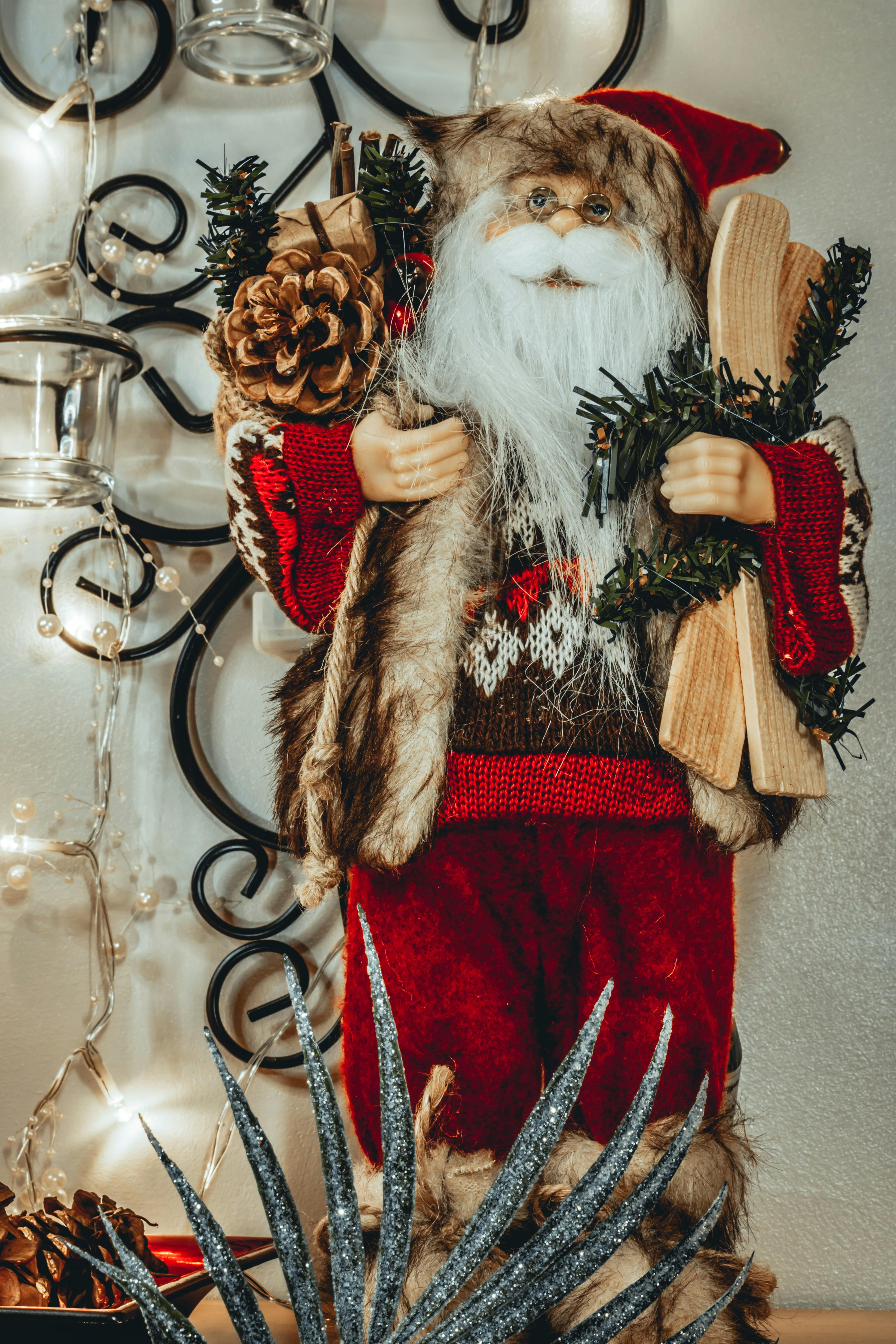 Santa Claus Figurine Beside Gold Framed Mirror · Free Stock Photo