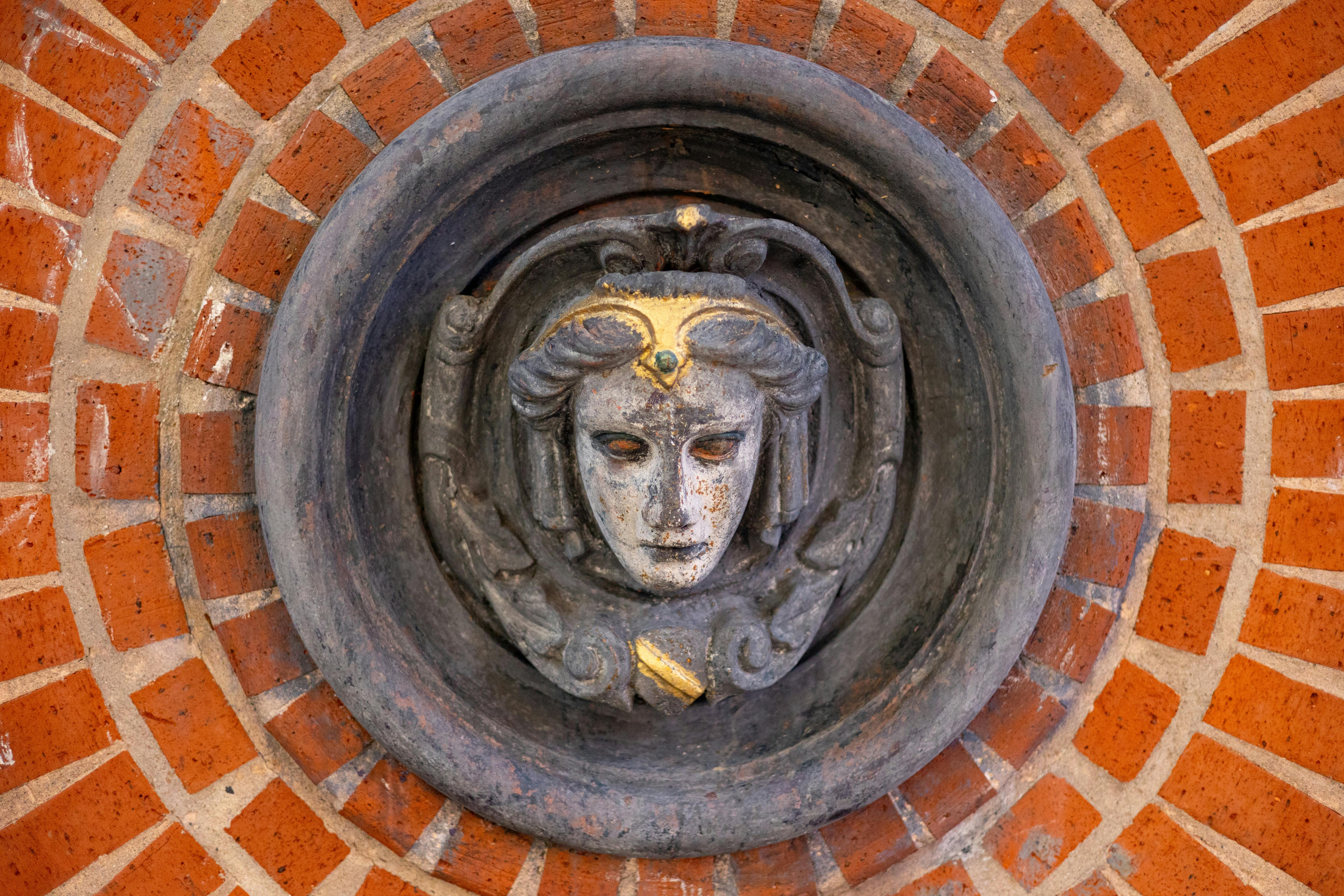 Concrete Statue in Solid Round Surface · Free Stock Photo