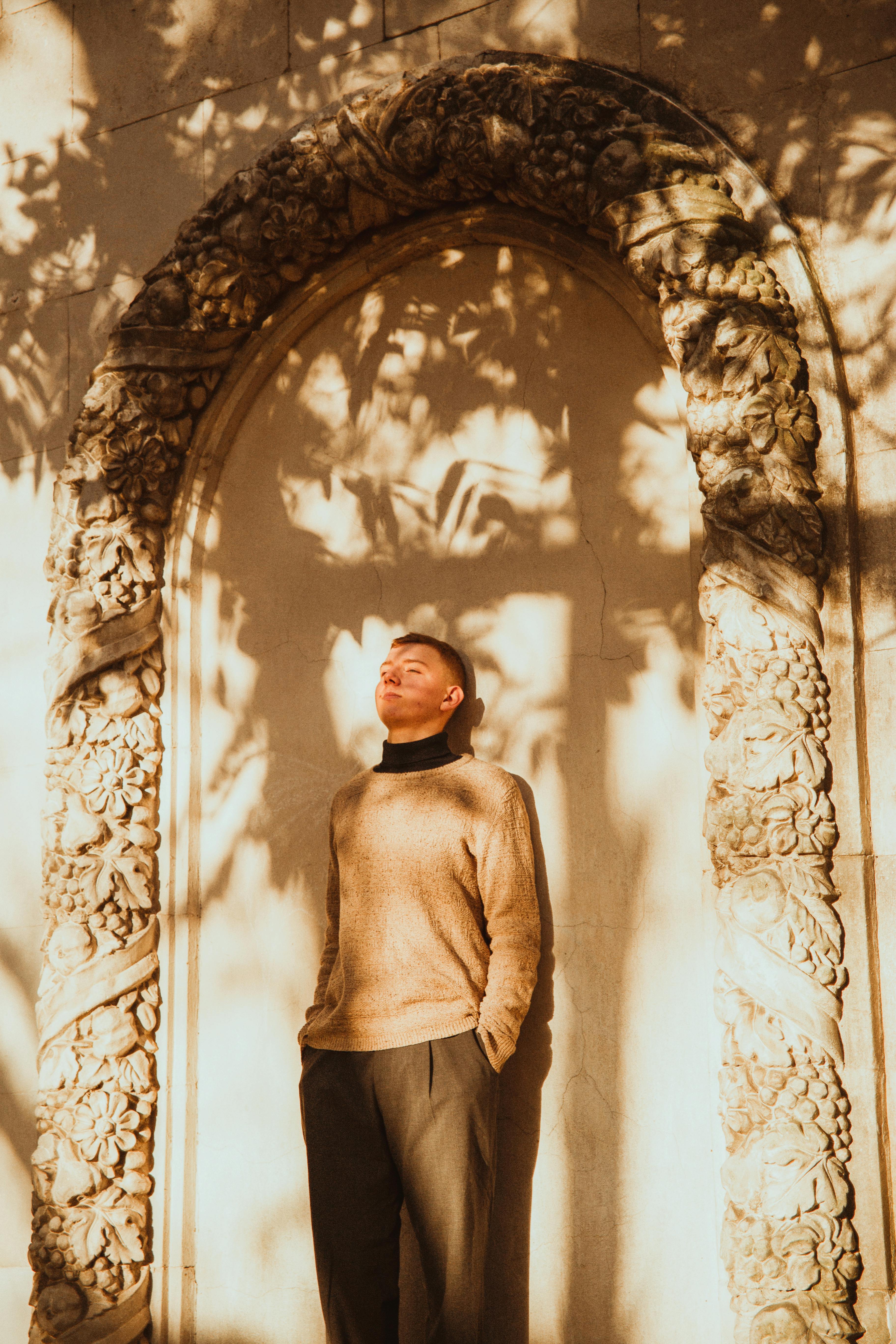 A Man Standing by a Building · Free Stock Photo