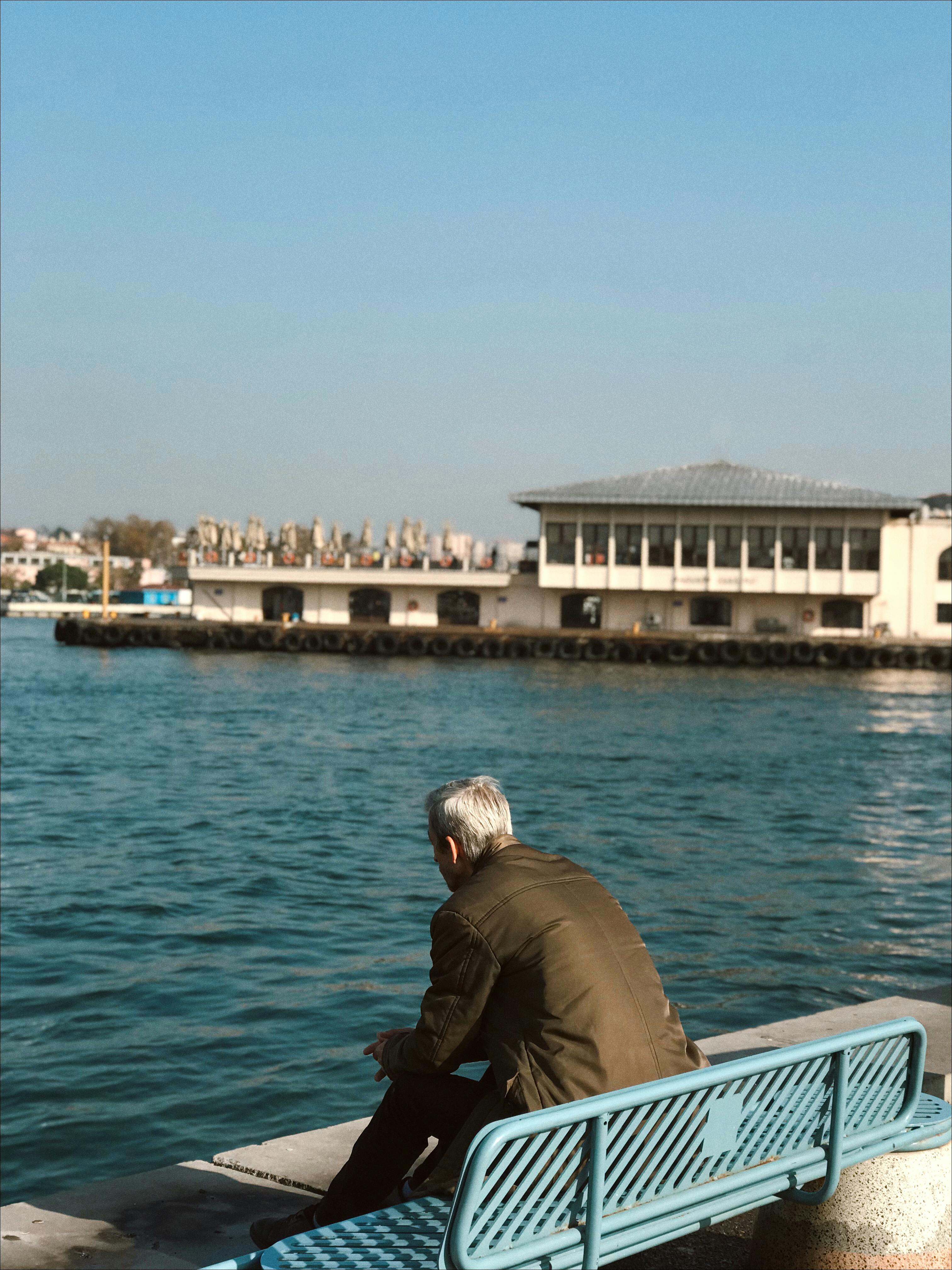 Man Standing on Platform on Water · Free Stock Photo