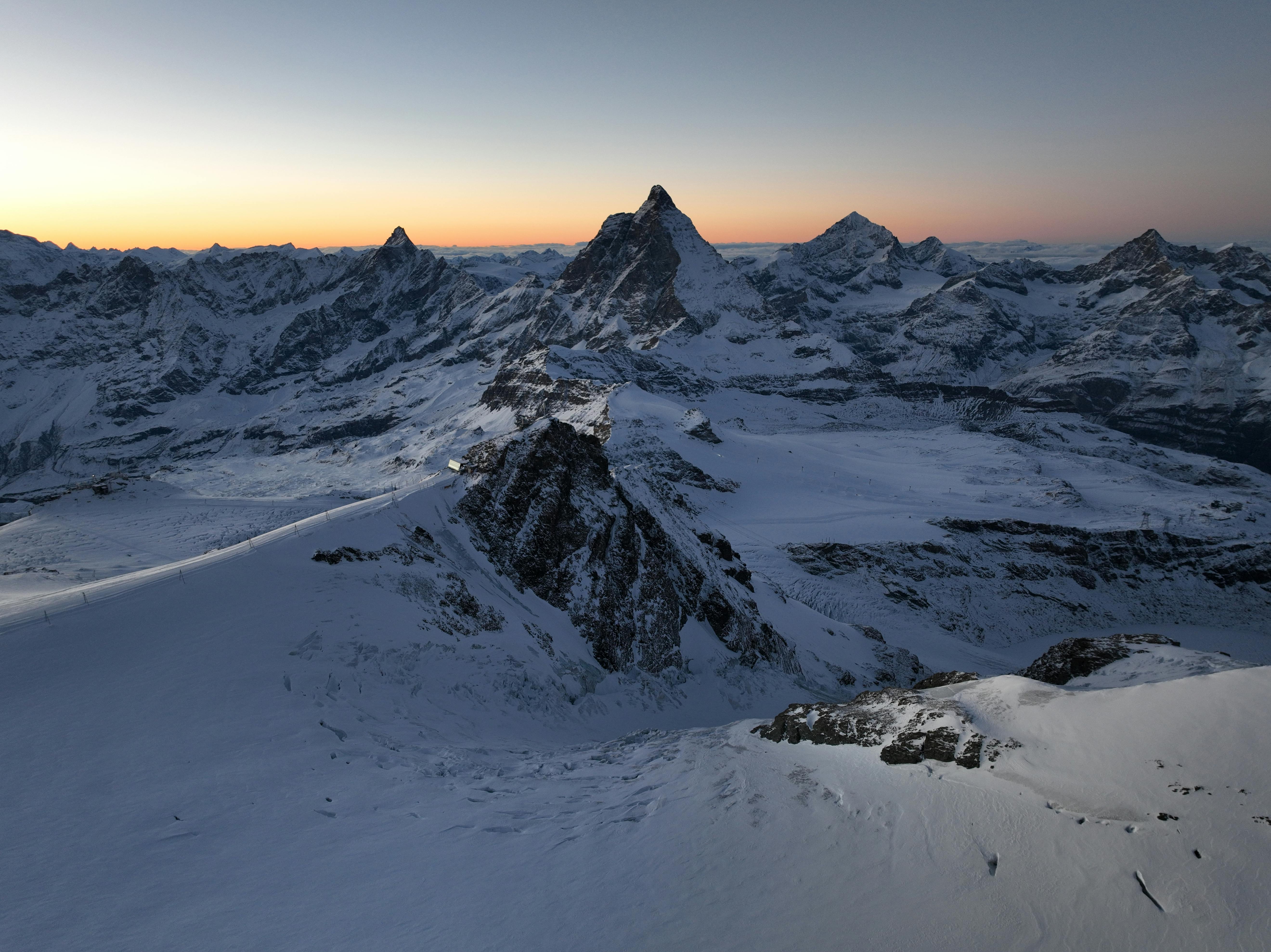 Snow Covered Mountains during Dawn · Free Stock Photo