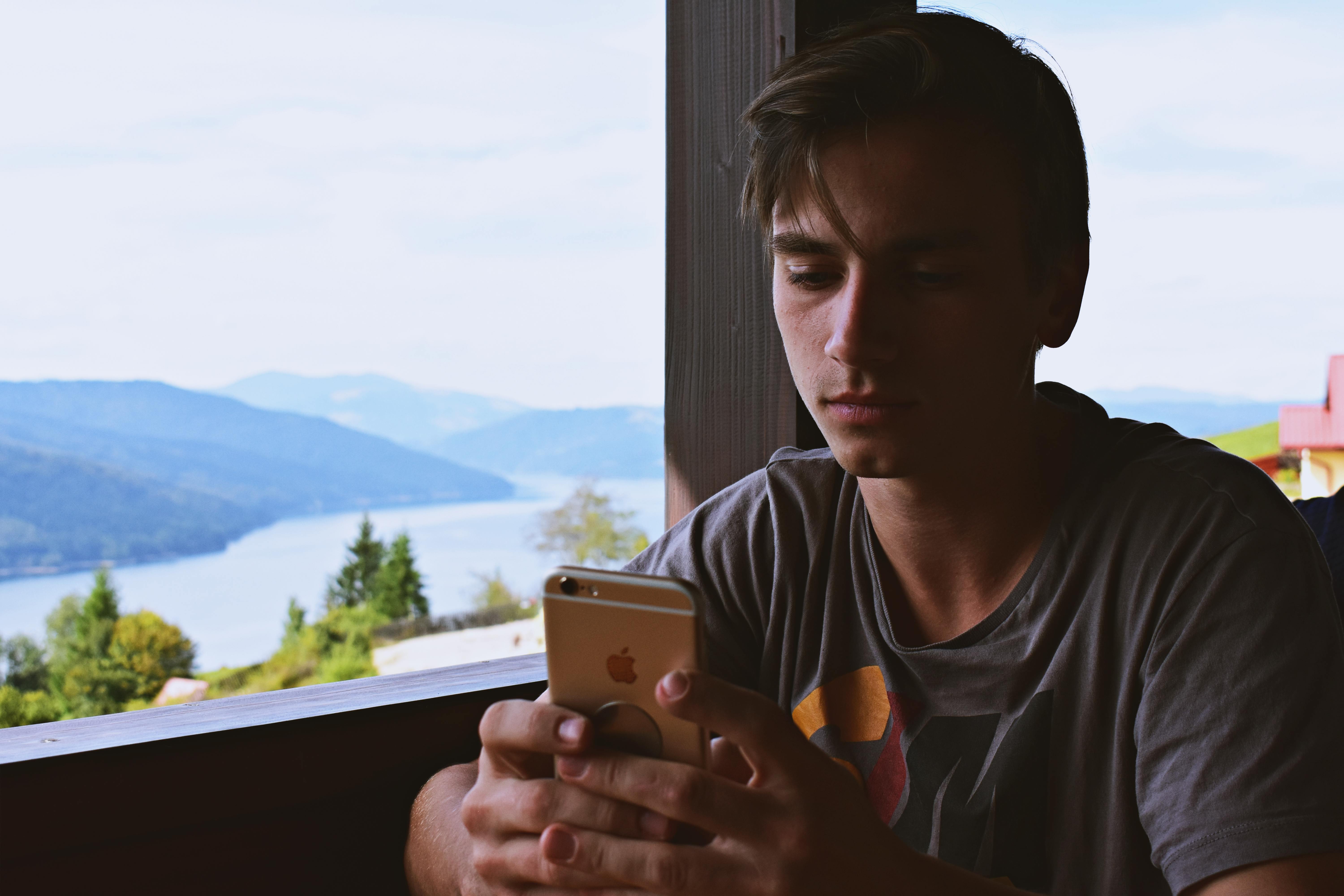 Man Holding Gold Iphone 6 · Free Stock Photo