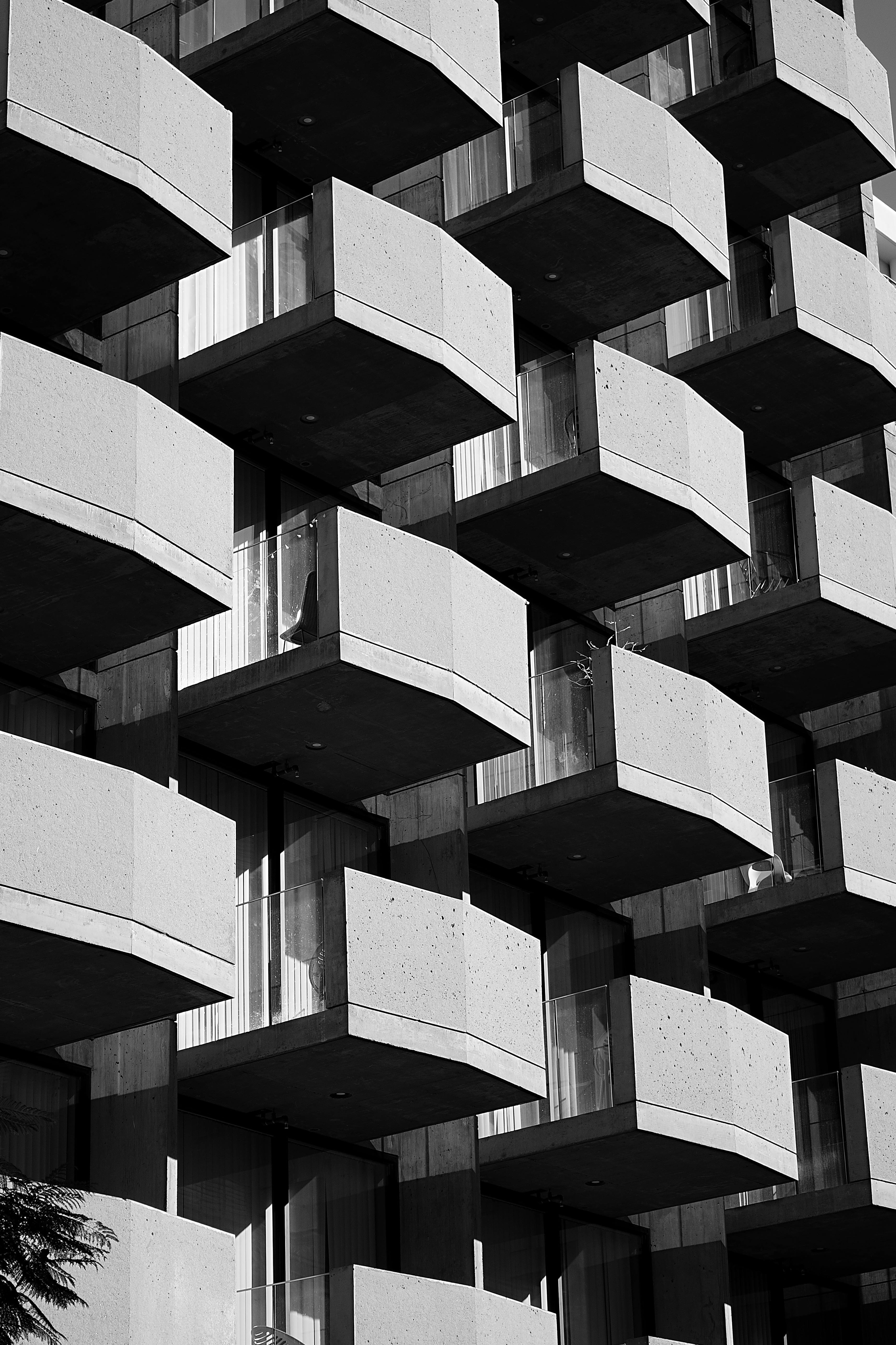 A Grayscale of a Building with Balconies · Free Stock Photo