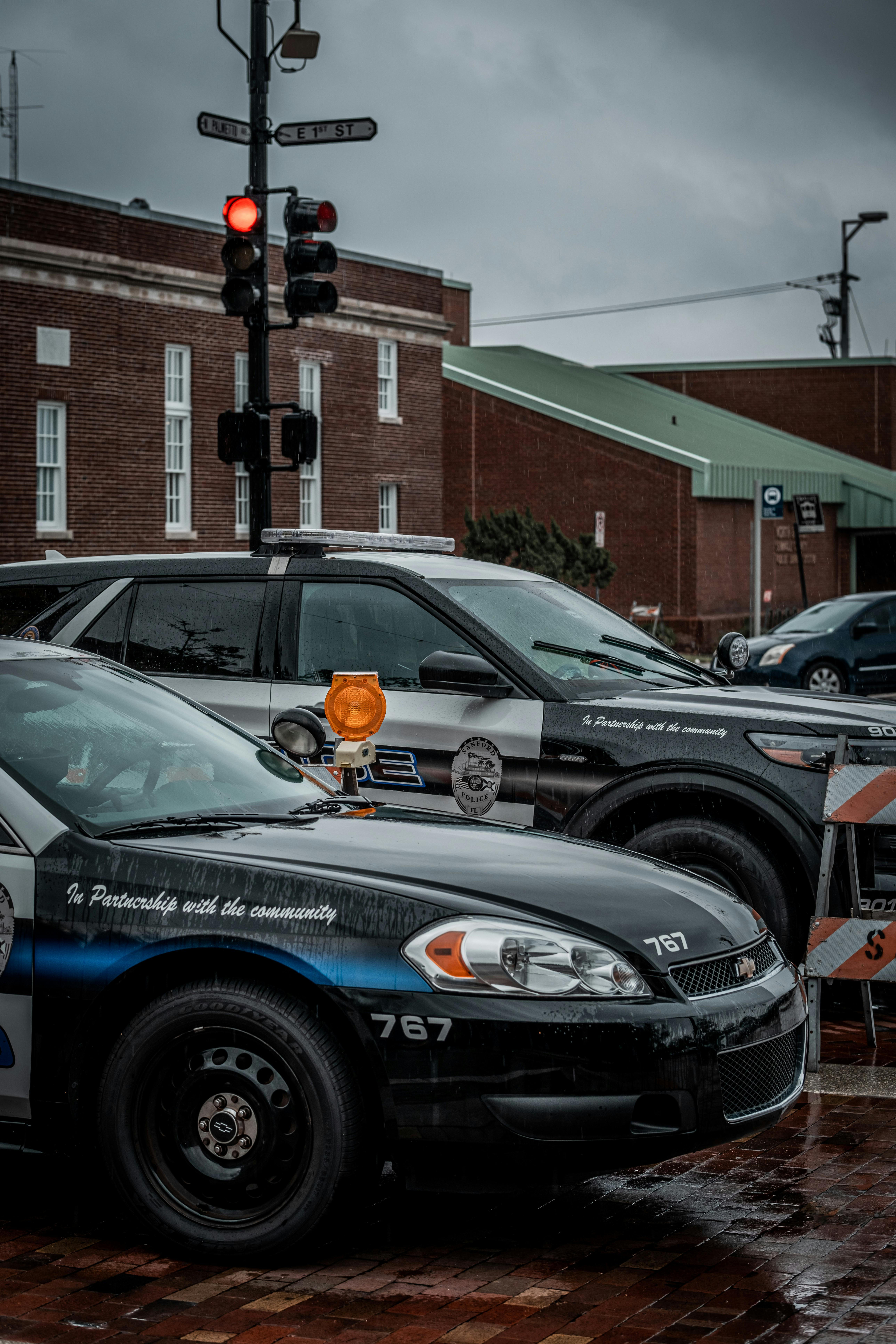 Black and Silver Car in Front of Brown Building · Free Stock Photo