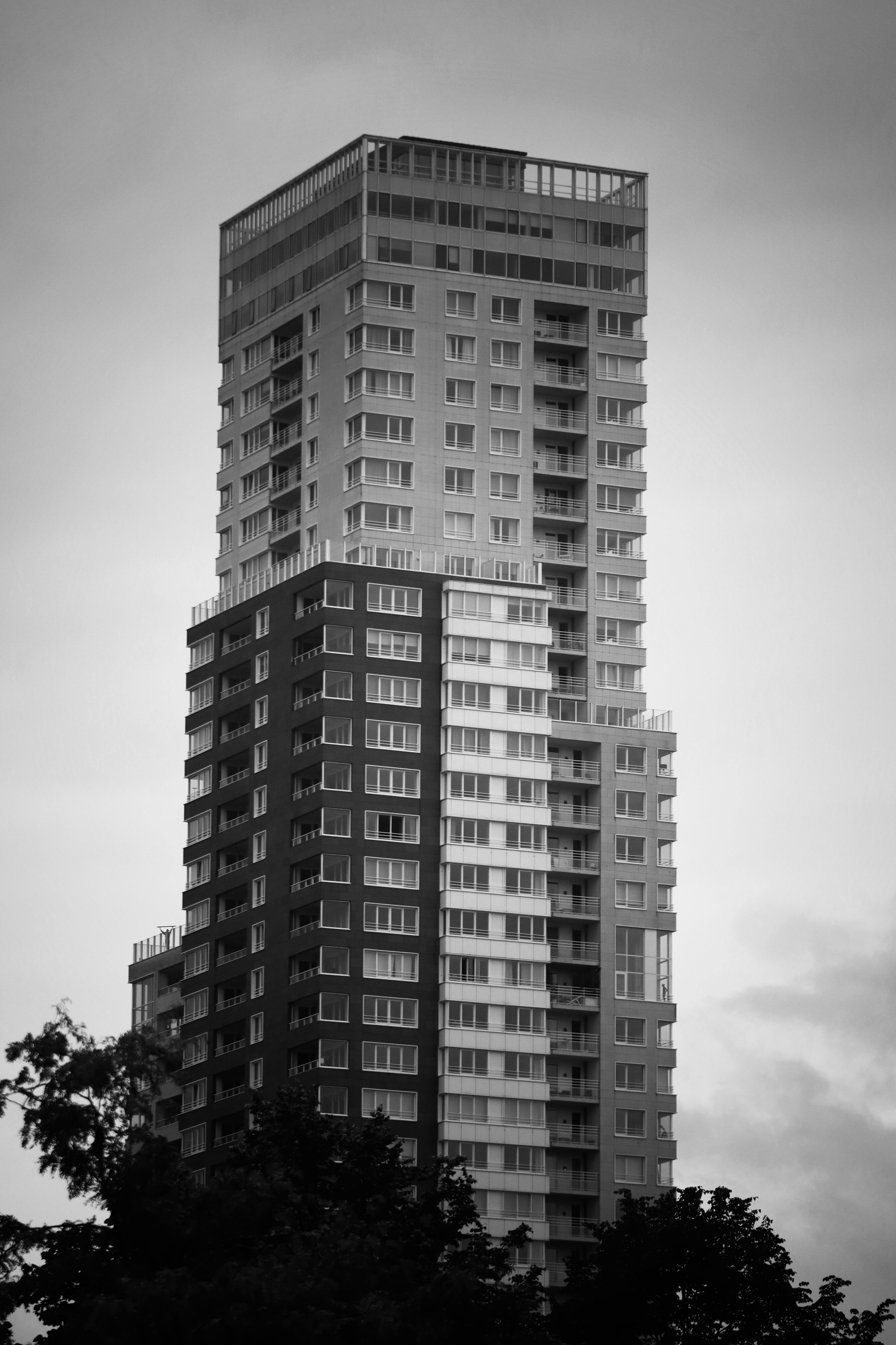 Grayscale Photo of a High Rise Building · Free Stock Photo