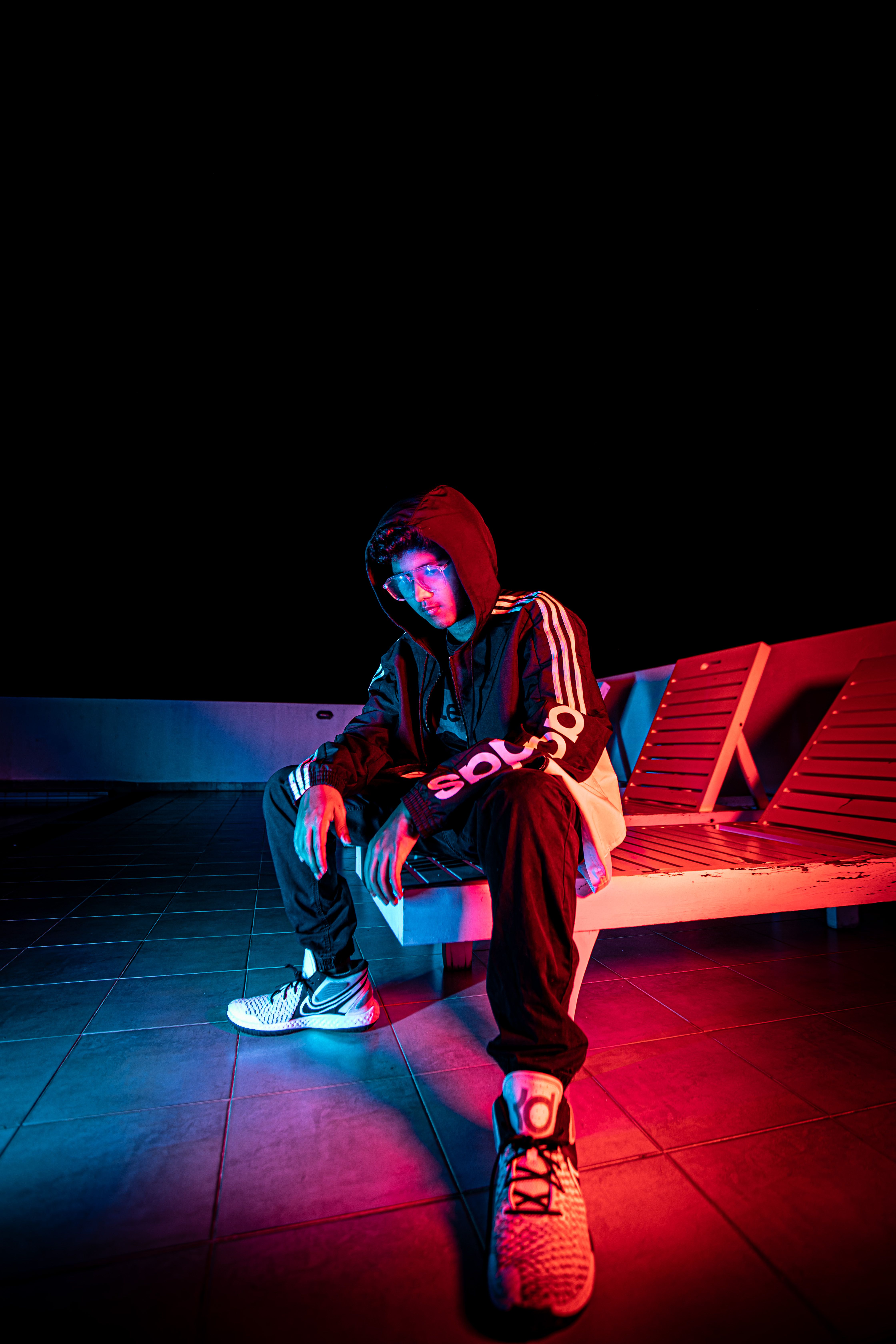 Man in Pink Tracksuit Standing on a Bench · Free Stock Photo