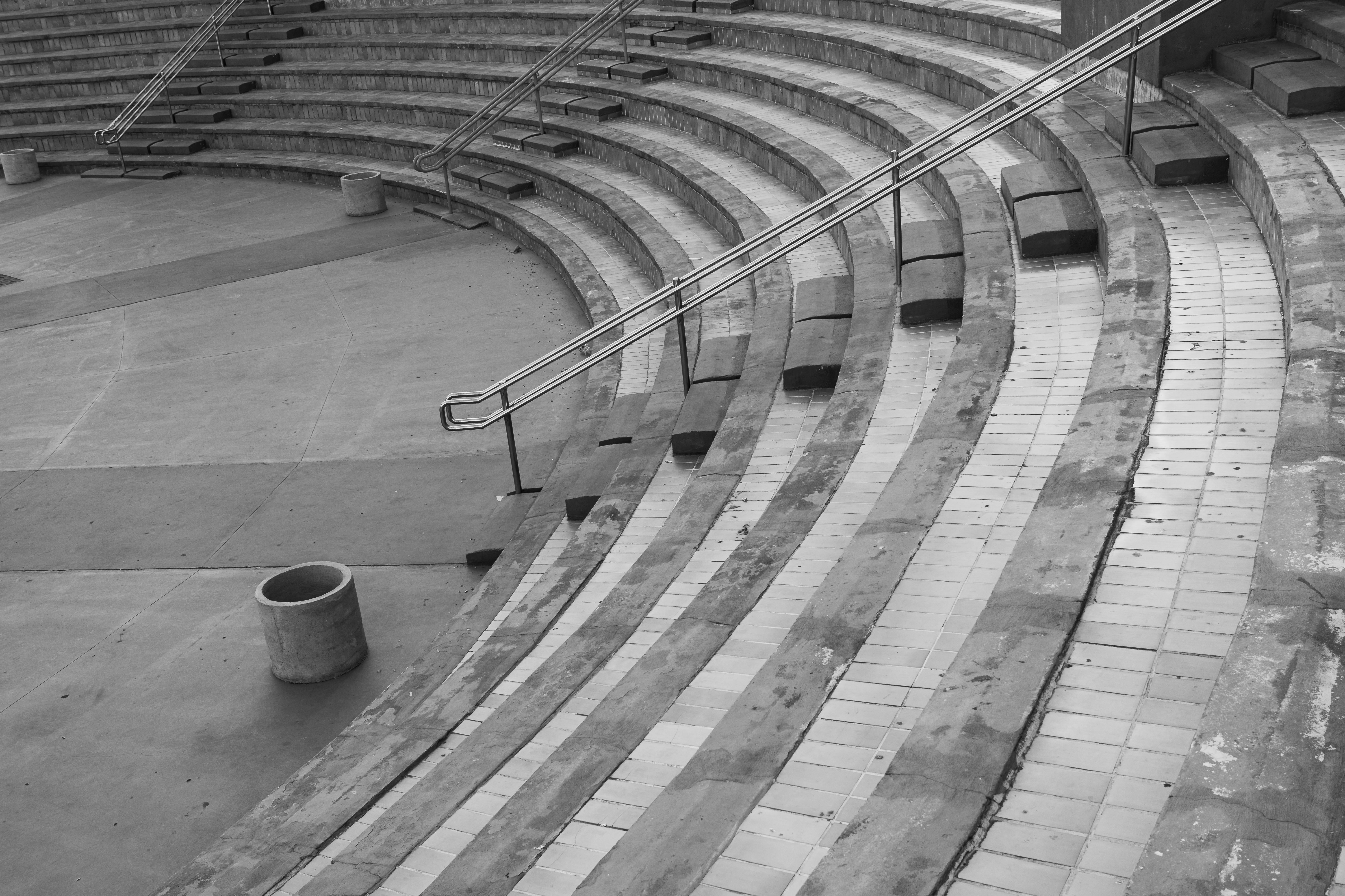 Grayscale Photo of an Amphitheatre Bleachers · Free Stock Photo