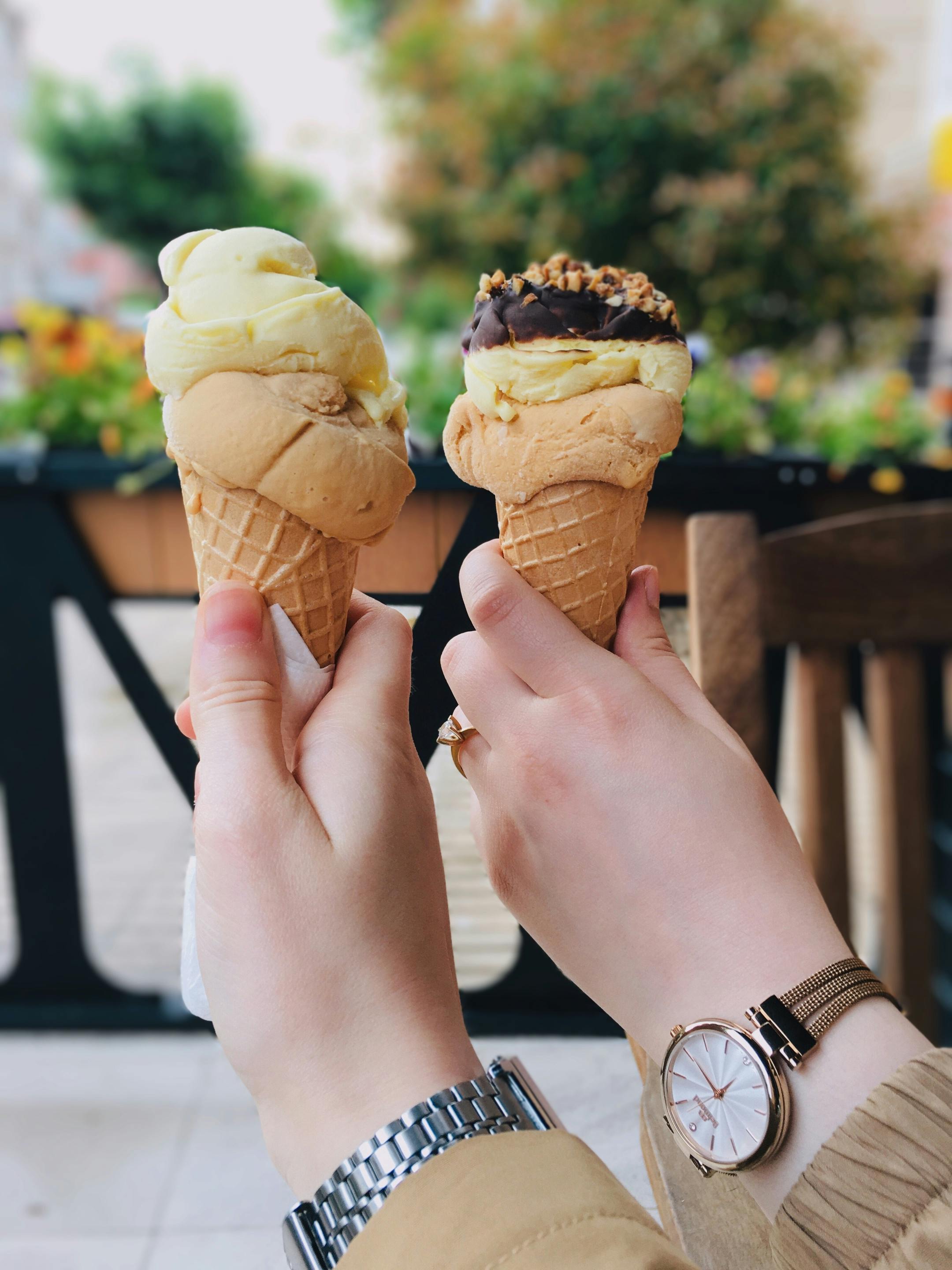 Two People Holding Ice-Creams in their Hands · Free Stock Photo