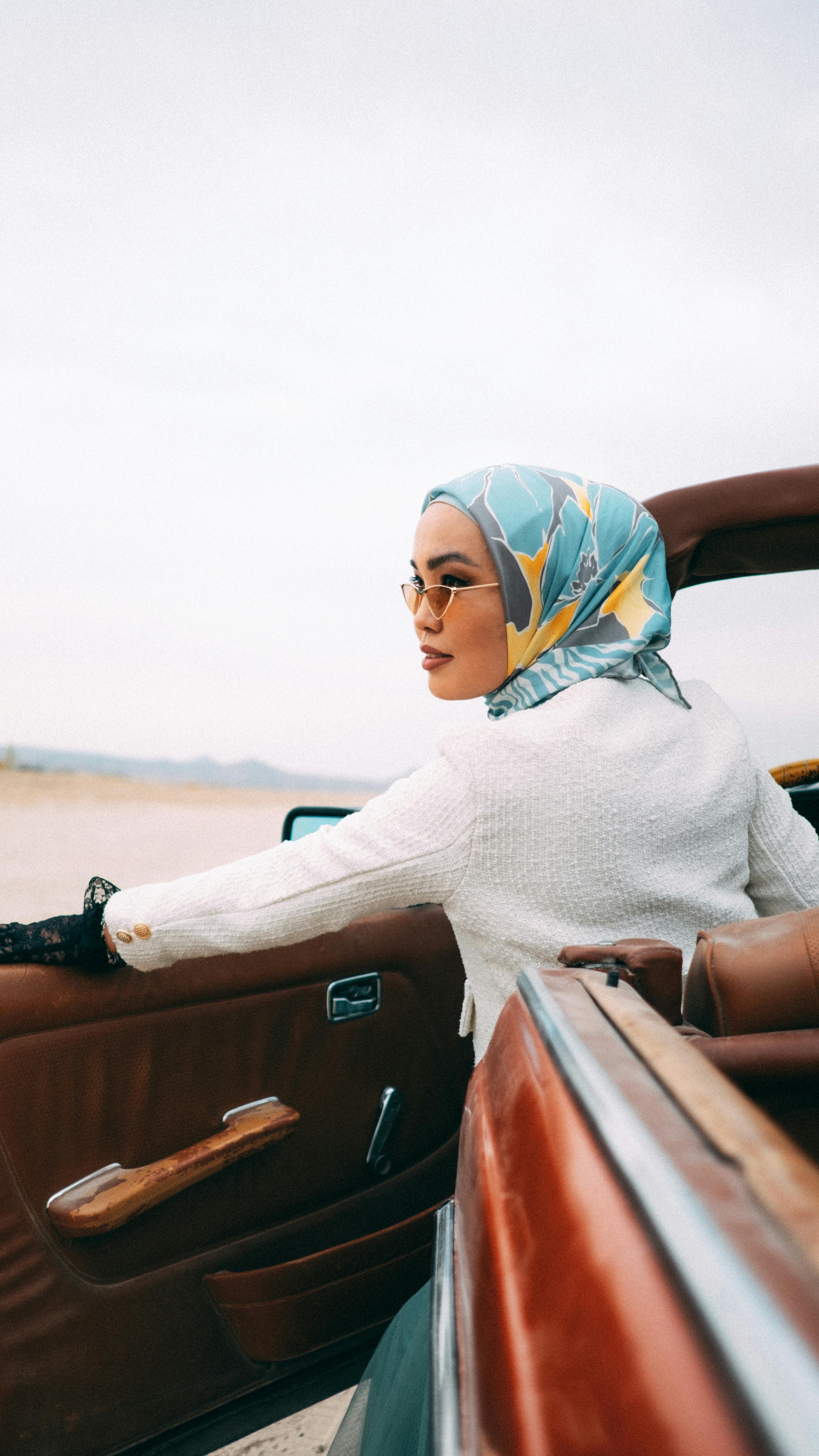 Woman in Hijab Entering Car · Free Stock Photo