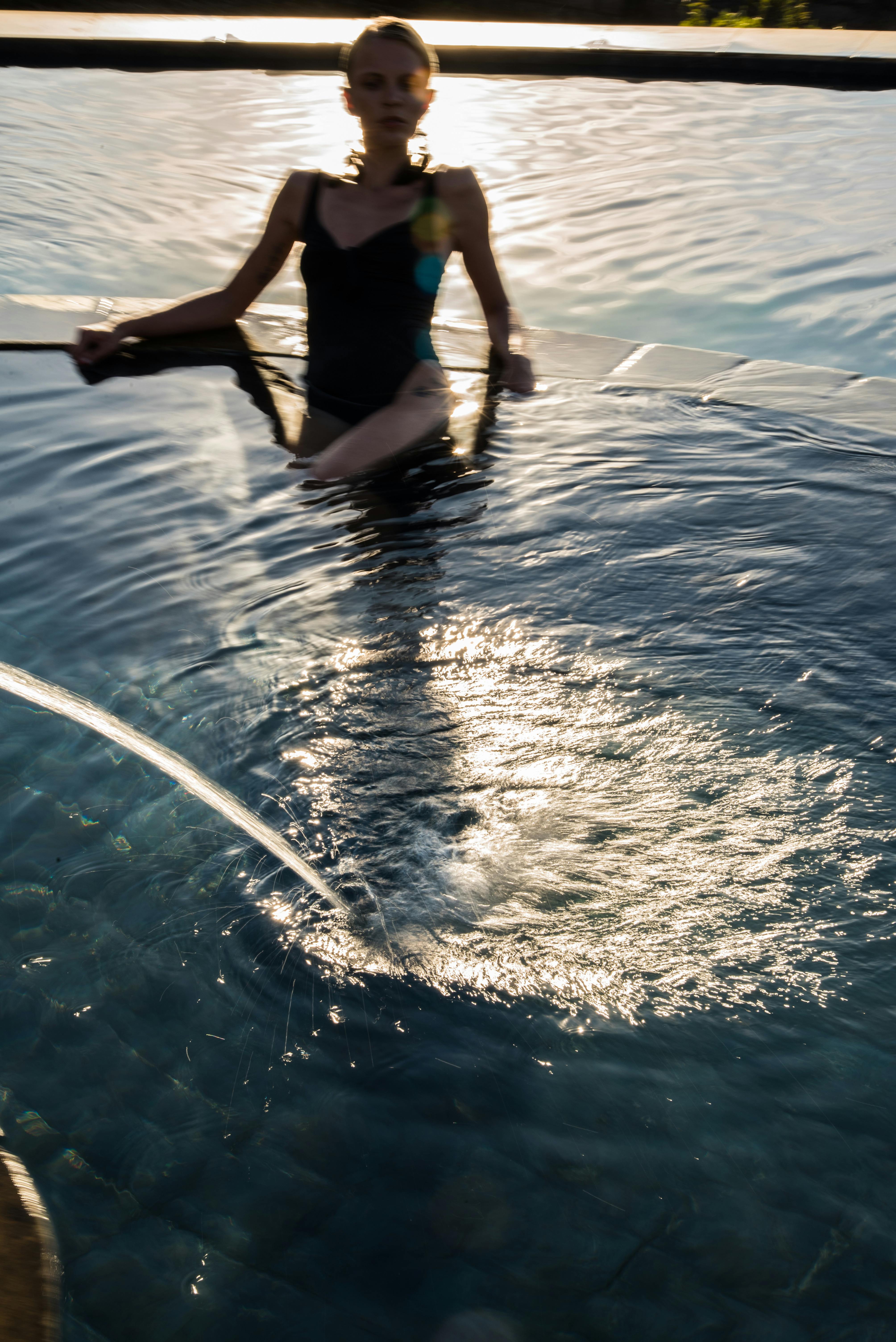 Woman in Swimwear Standing in a Pool · Free Stock Photo