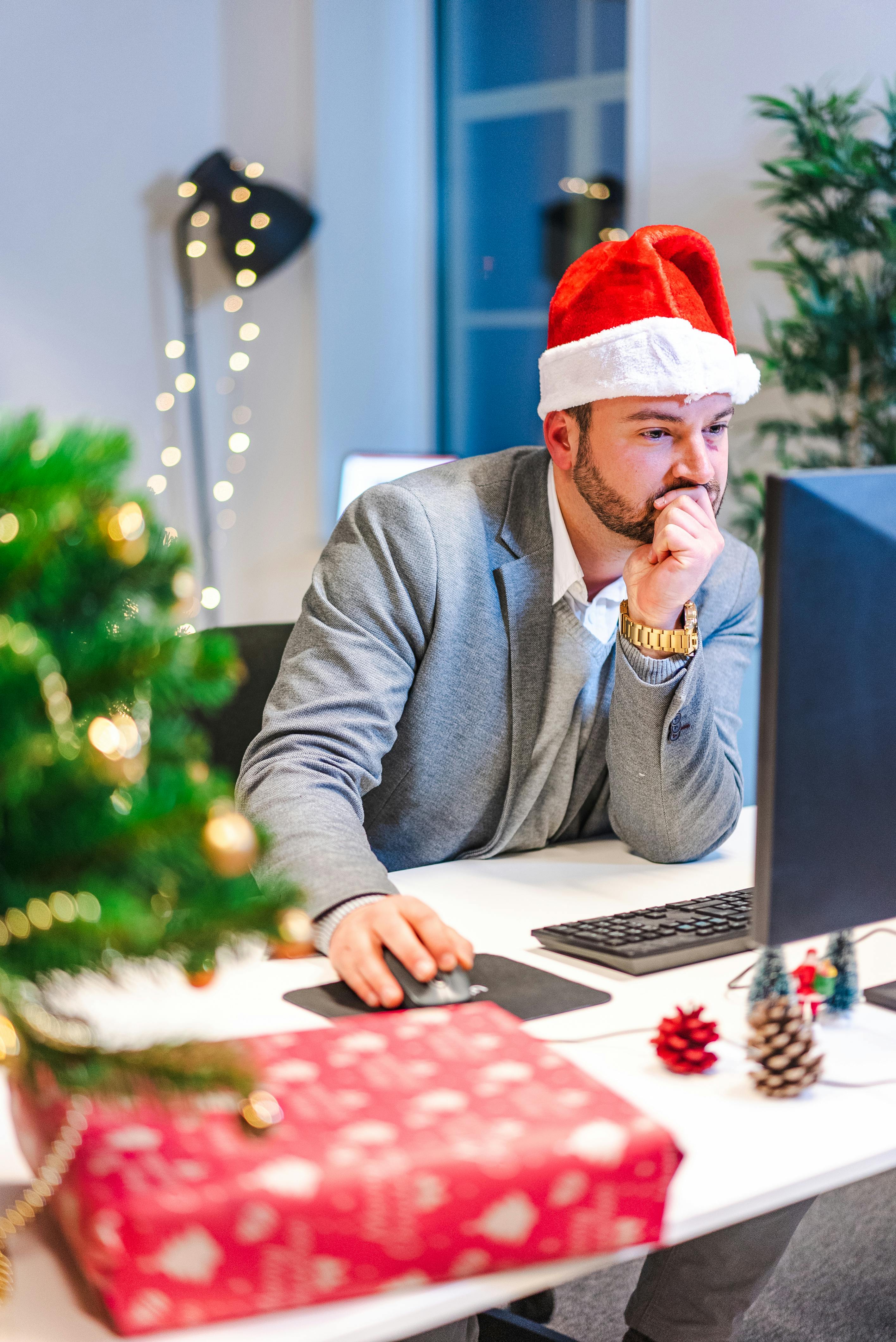 A Man in Gray Suit Looking at the Computer Monitor · Free Stock Photo