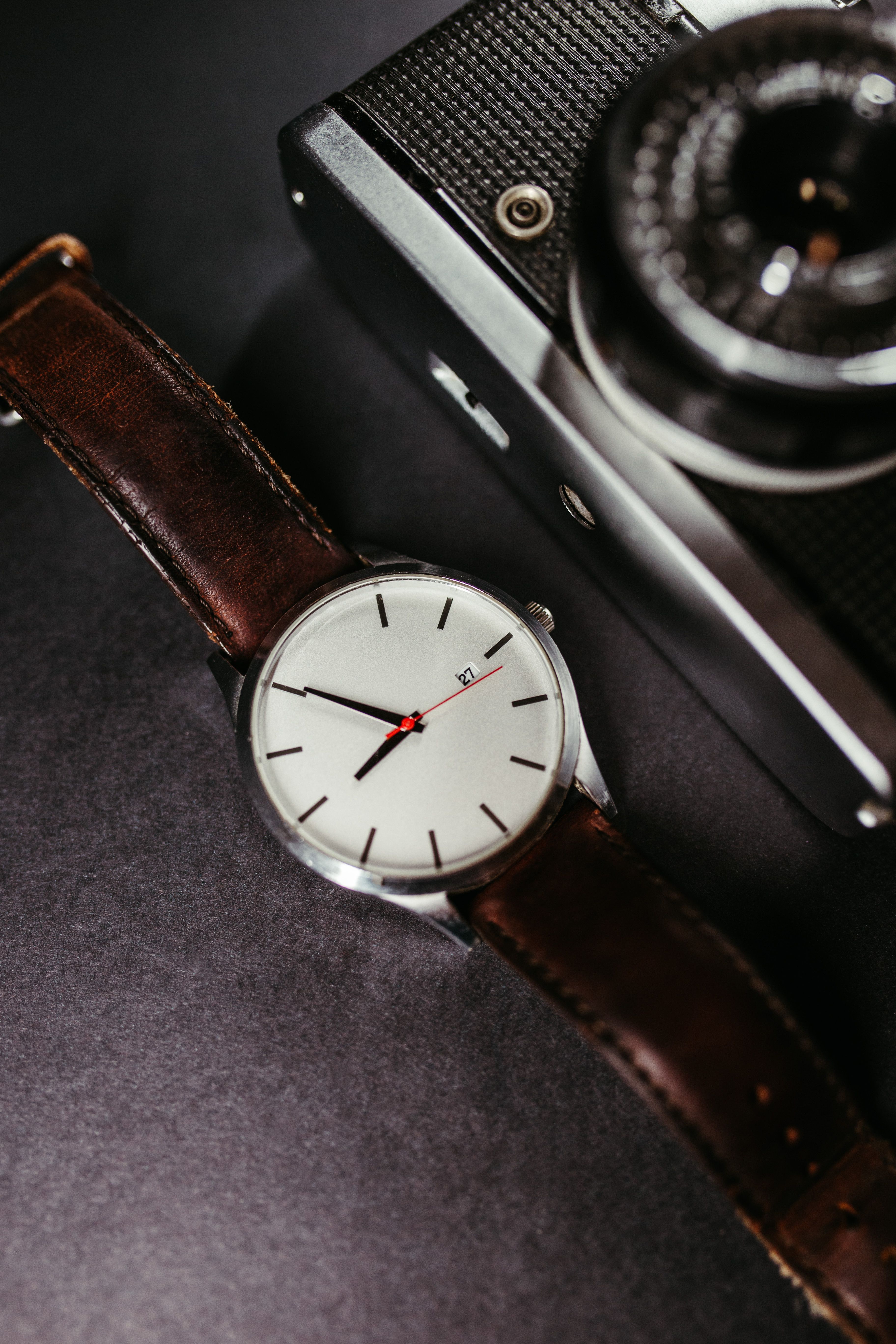 Brown Leather Strap Silver Round Analog Watch Beside a Camera · Free ...