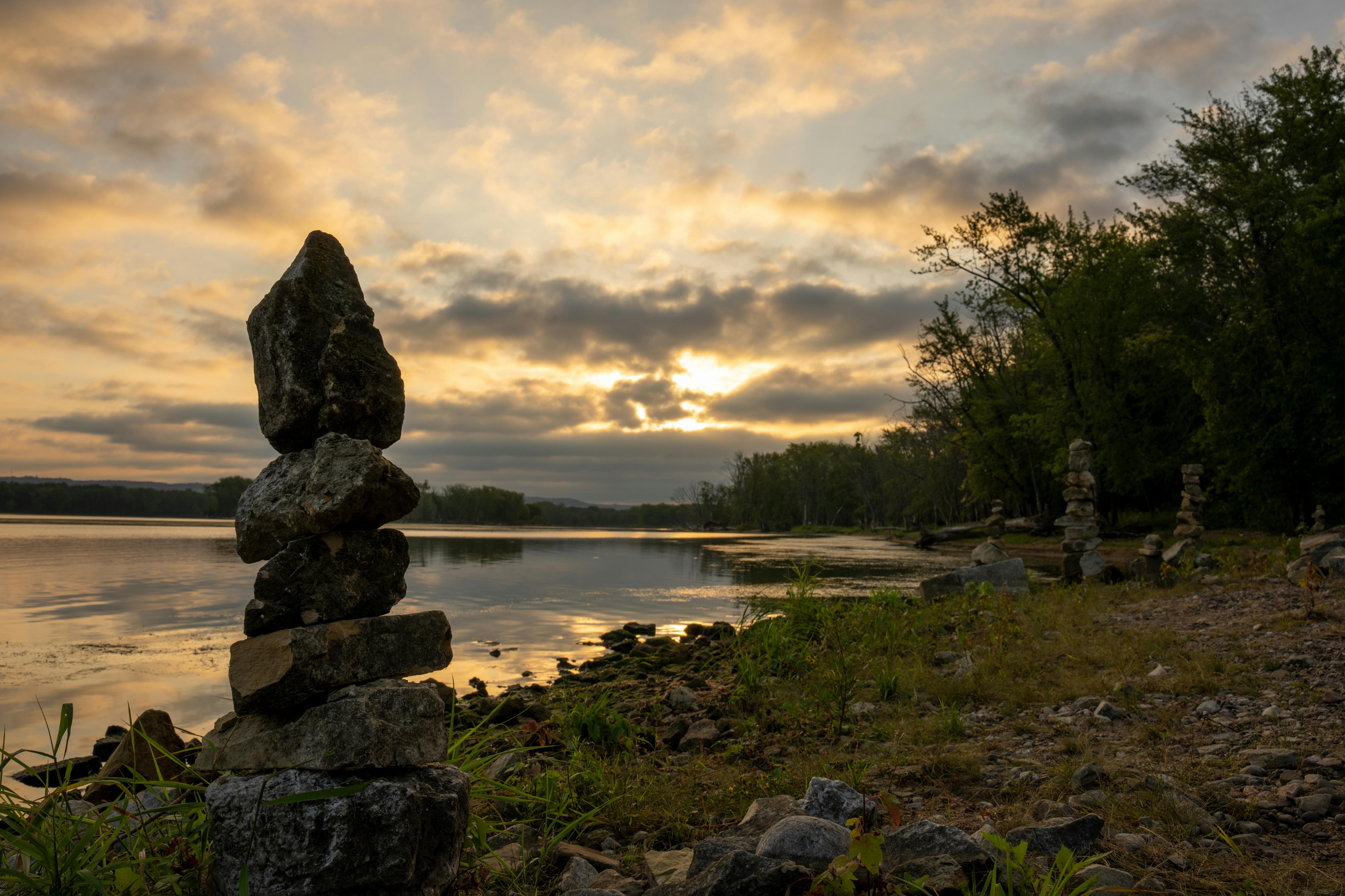 A Rock Balancing Near Body of Water · Free Stock Photo