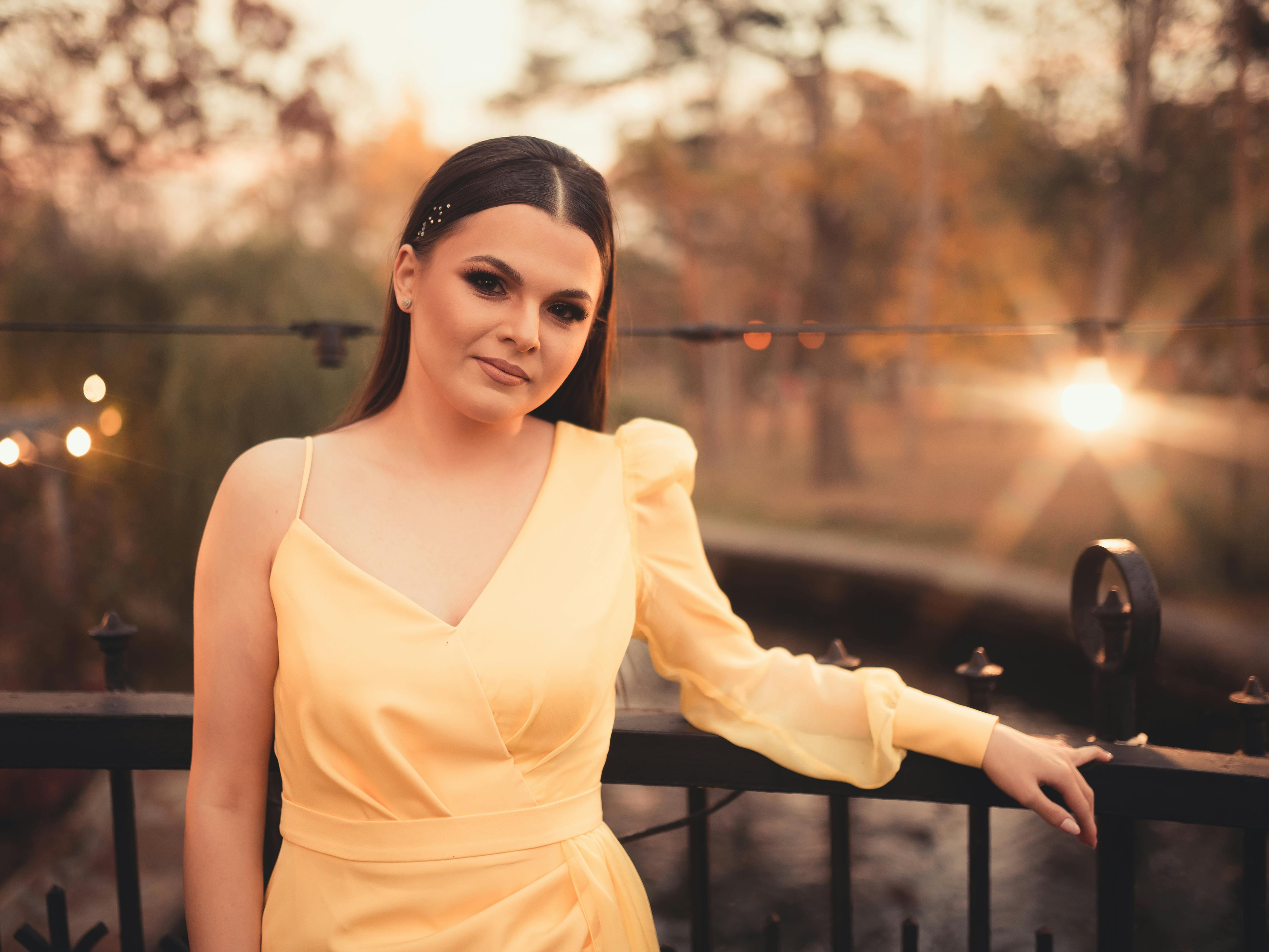 Woman Leaning on a Railing · Free Stock Photo