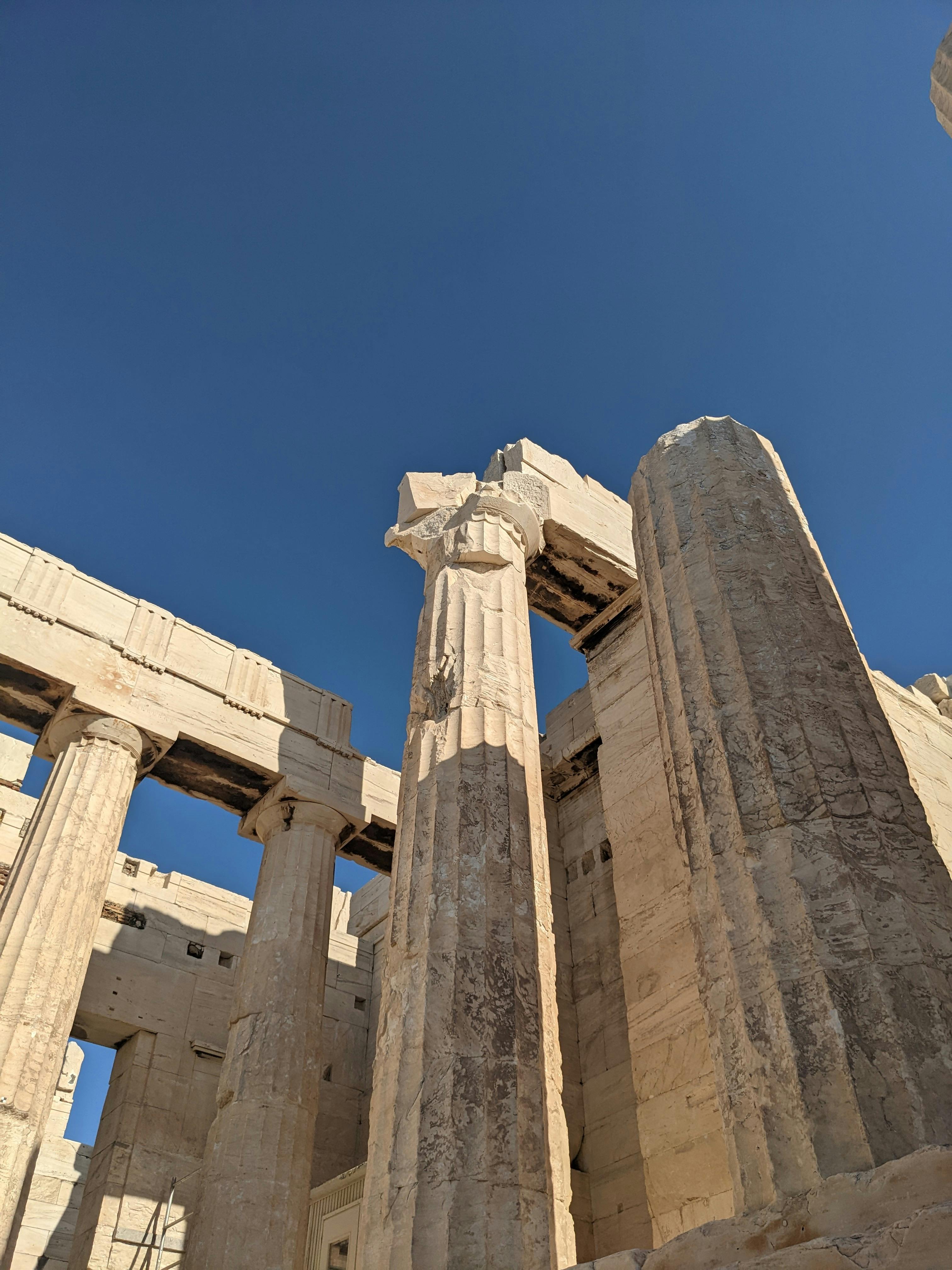 White and Shabby Ancient Greek Pillars · Free Stock Photo