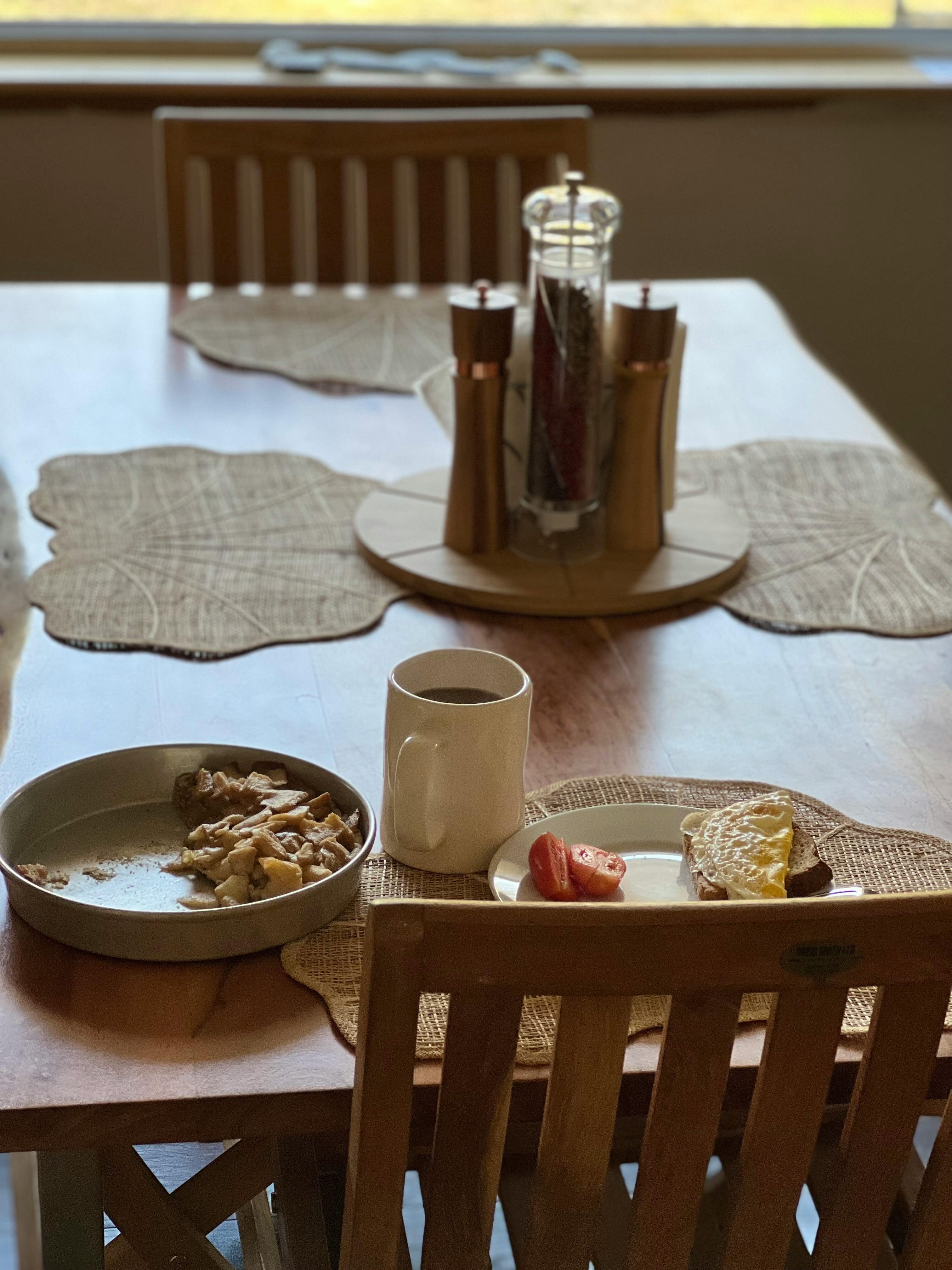Stainless Steel Cup on Brown Wooden Top Table · Free Stock Photo