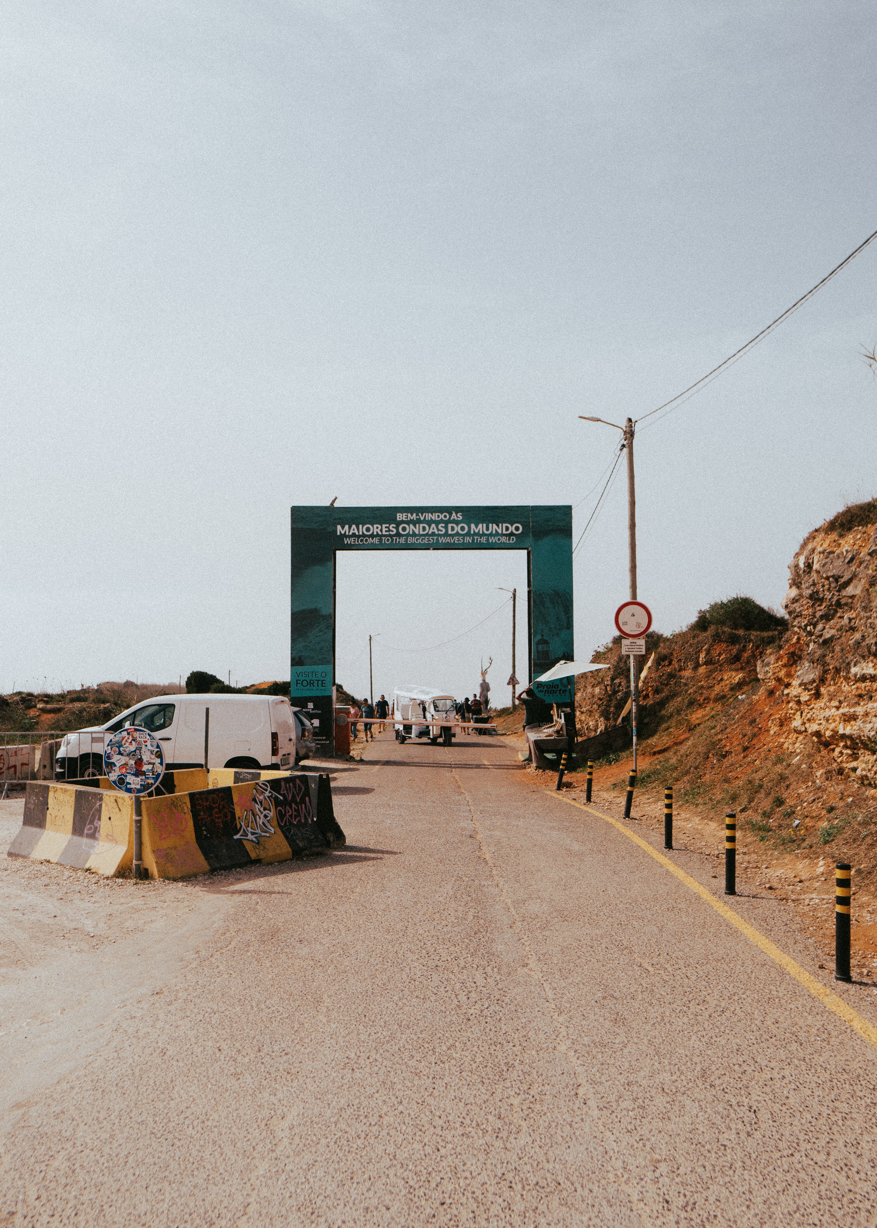 Gate on Road on Arid Hill · Free Stock Photo