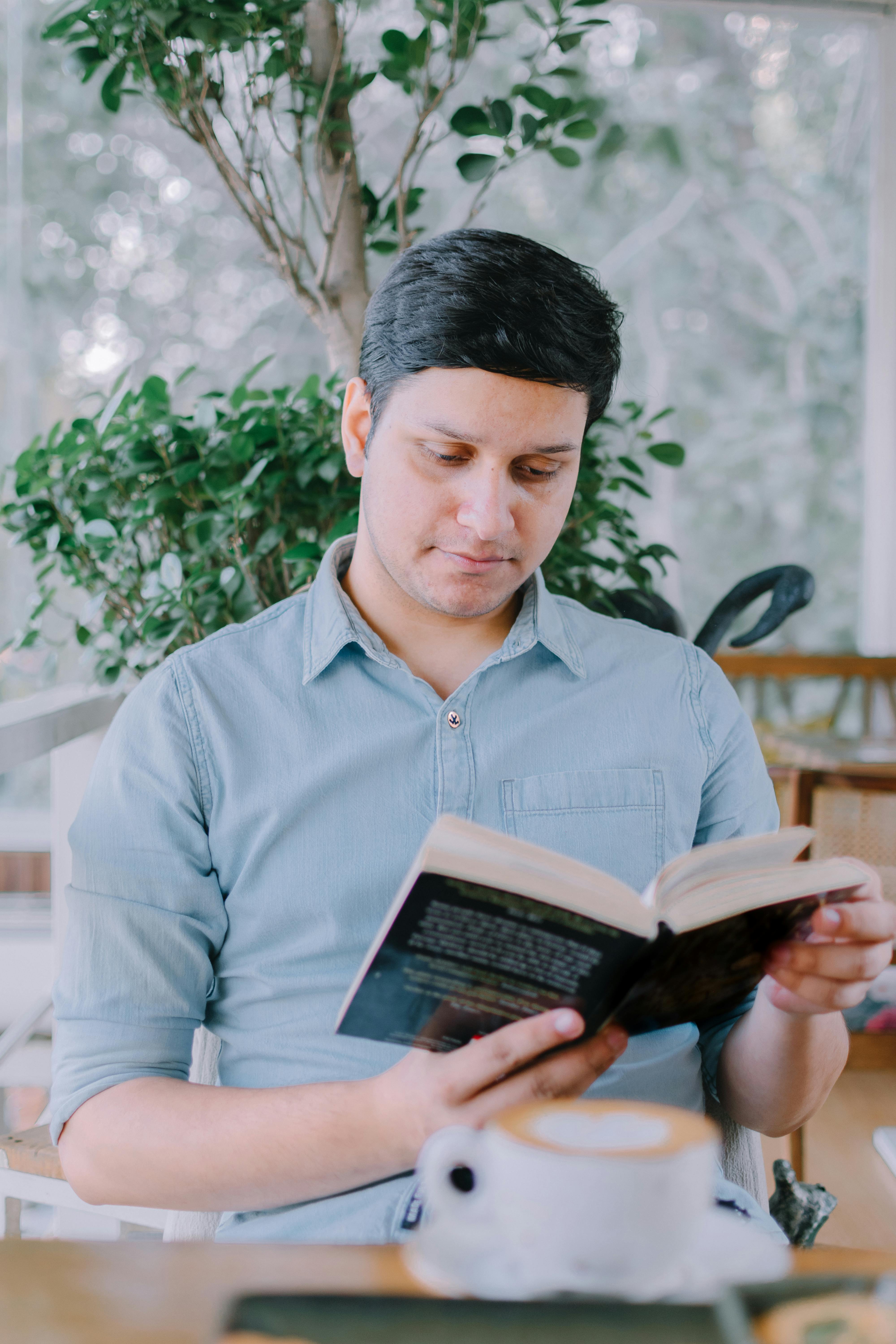 Photo of a Man Reading Book · Free Stock Photo