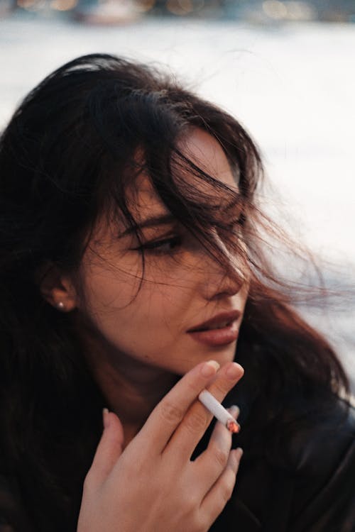 Close up of a Young Woman Smoking a Cigarette · Free Stock Photo Close up of a Young Woman Smoking a Cigarette · Free Stock Photo