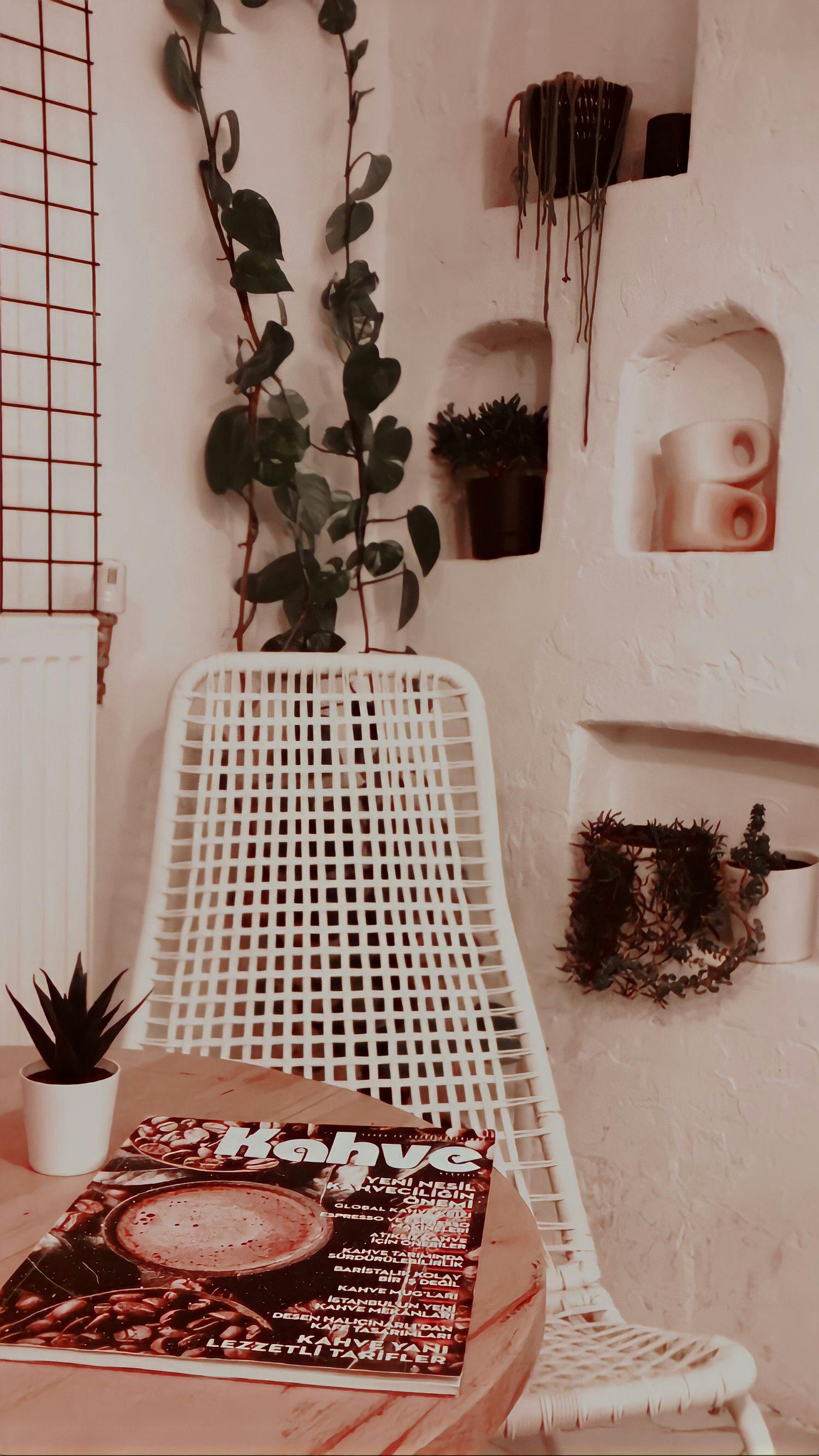 Table and Chairs under Sezai Karakoc Poem on Wall · Free Stock Photo