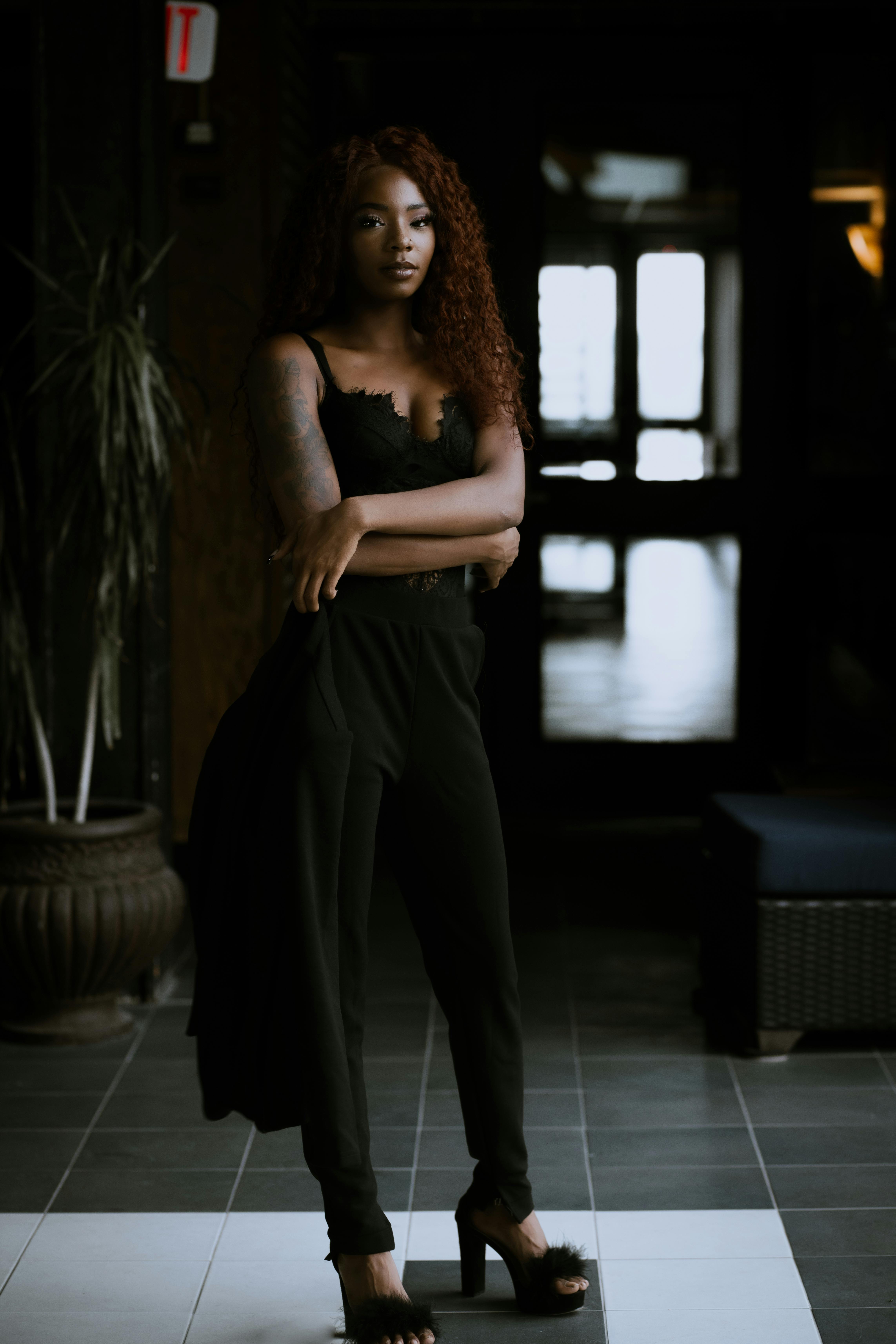 A Woman Wearing Black Jumpsuit · Free Stock Photo