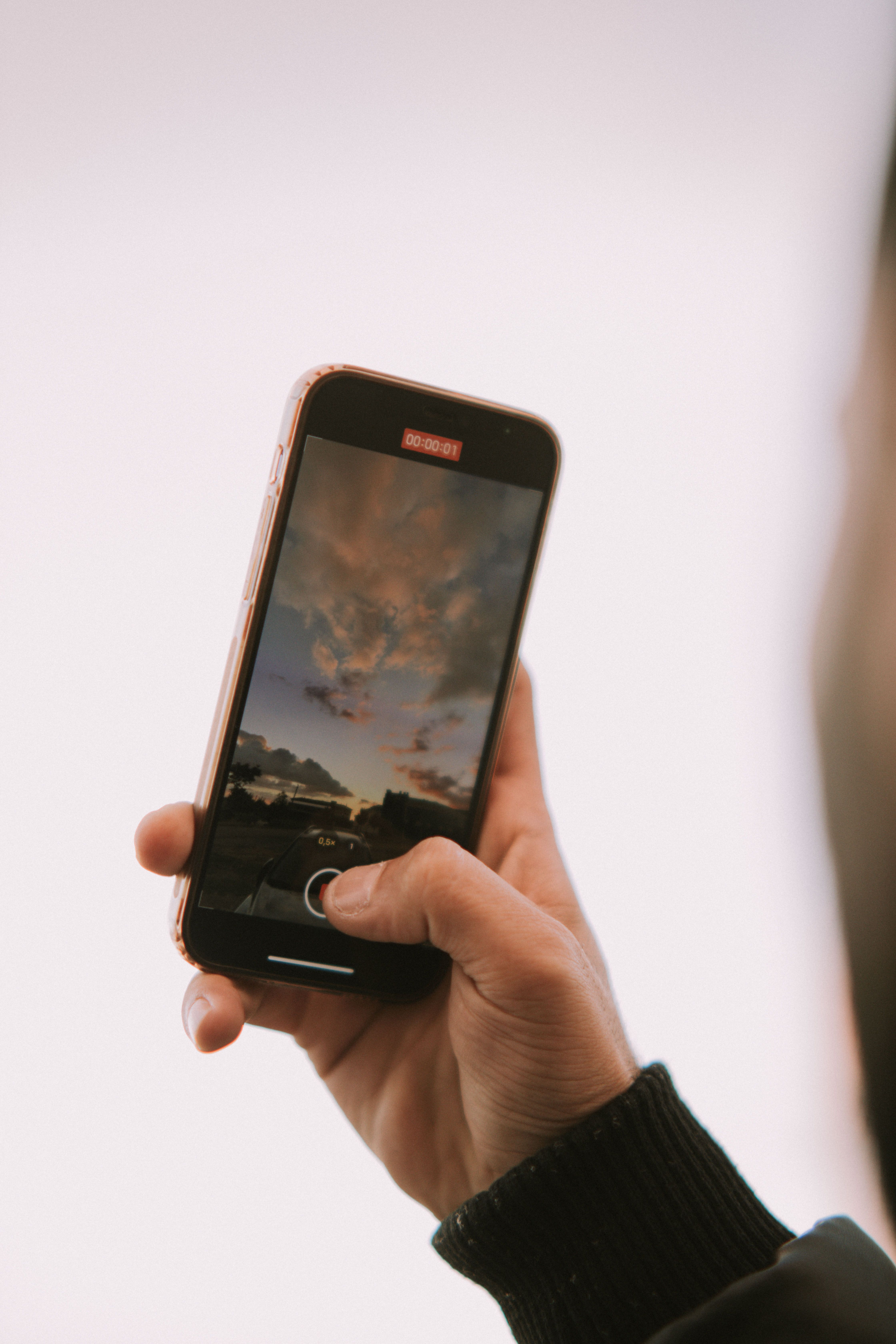 A Close-Up Shot of a Person Recording Using a Smartphone · Free Stock Photo