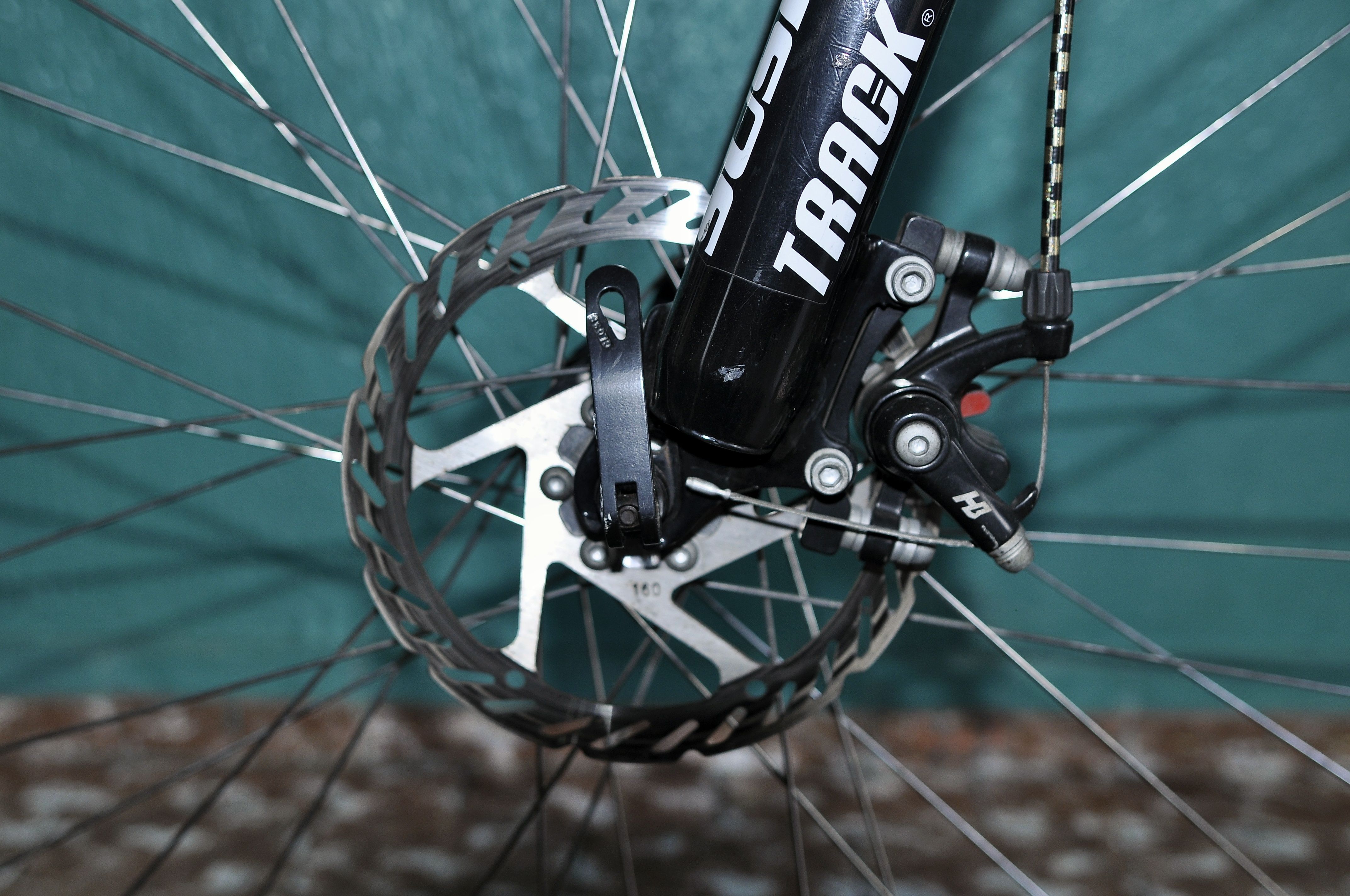 A Close-Up Shot of a Brake Caliper of a Bike · Free Stock Photo