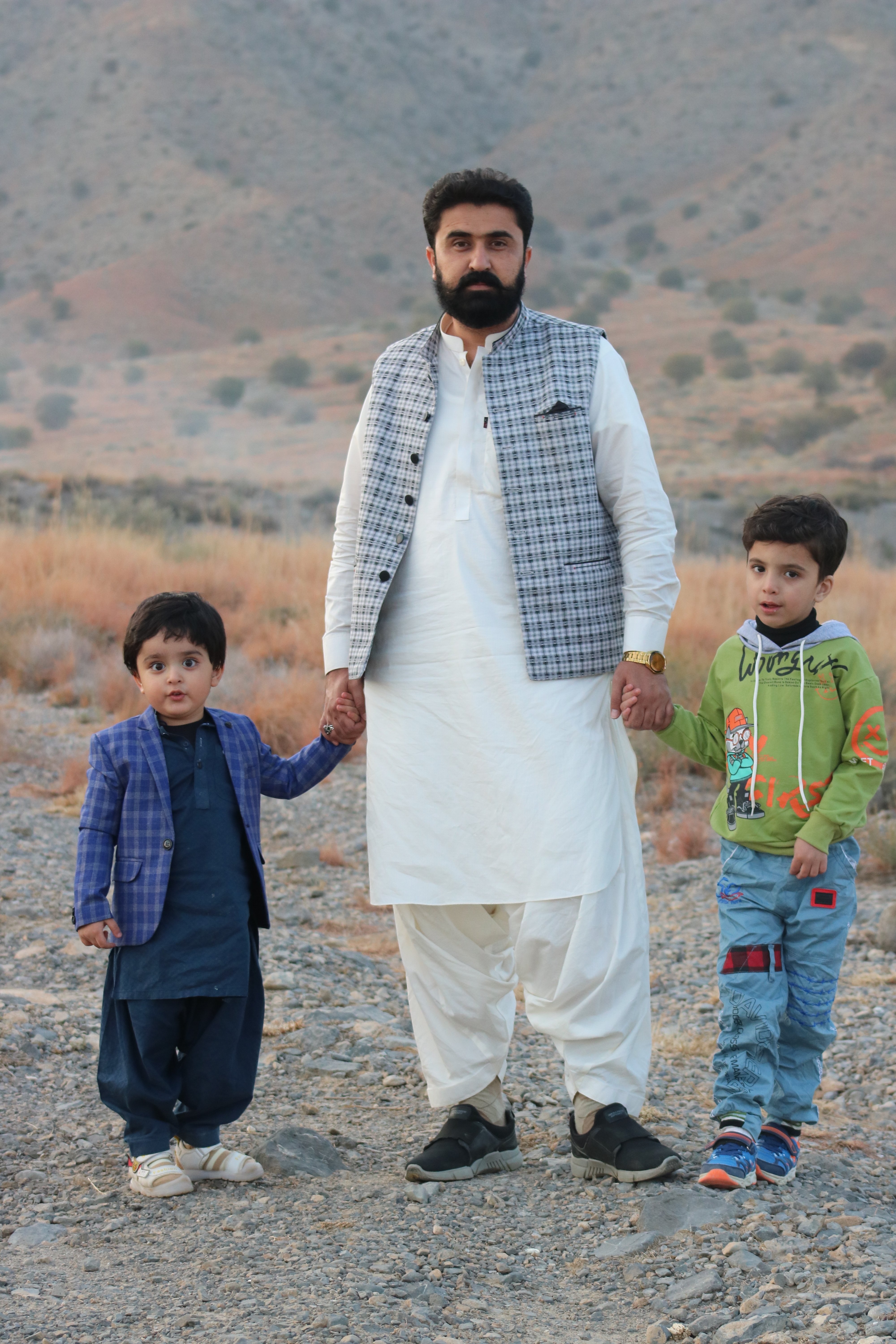 Pakistani Man Holding Hands with his Sons · Free Stock Photo