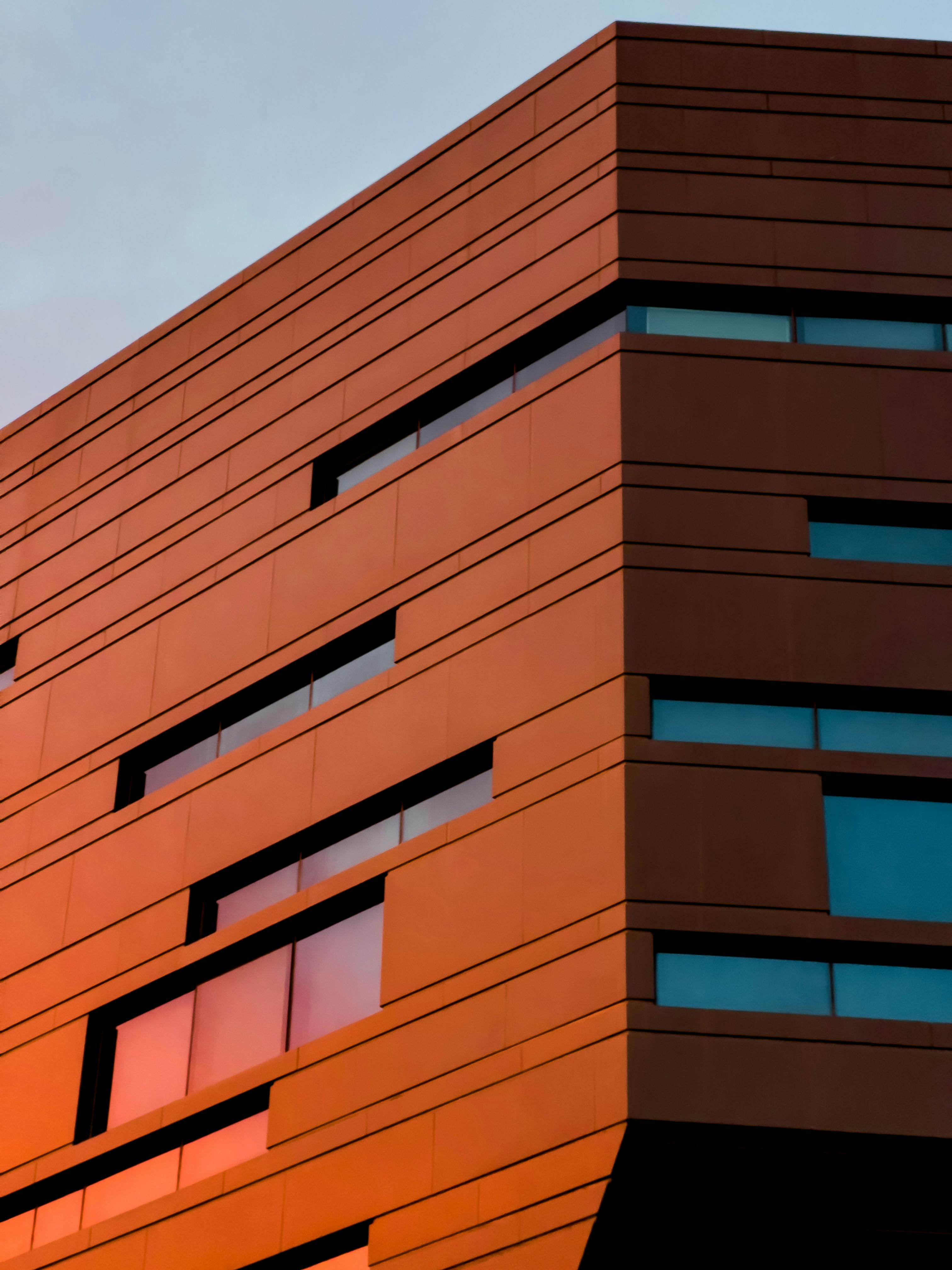 Corner of Modern Red Building at Sunlight · Free Stock Photo