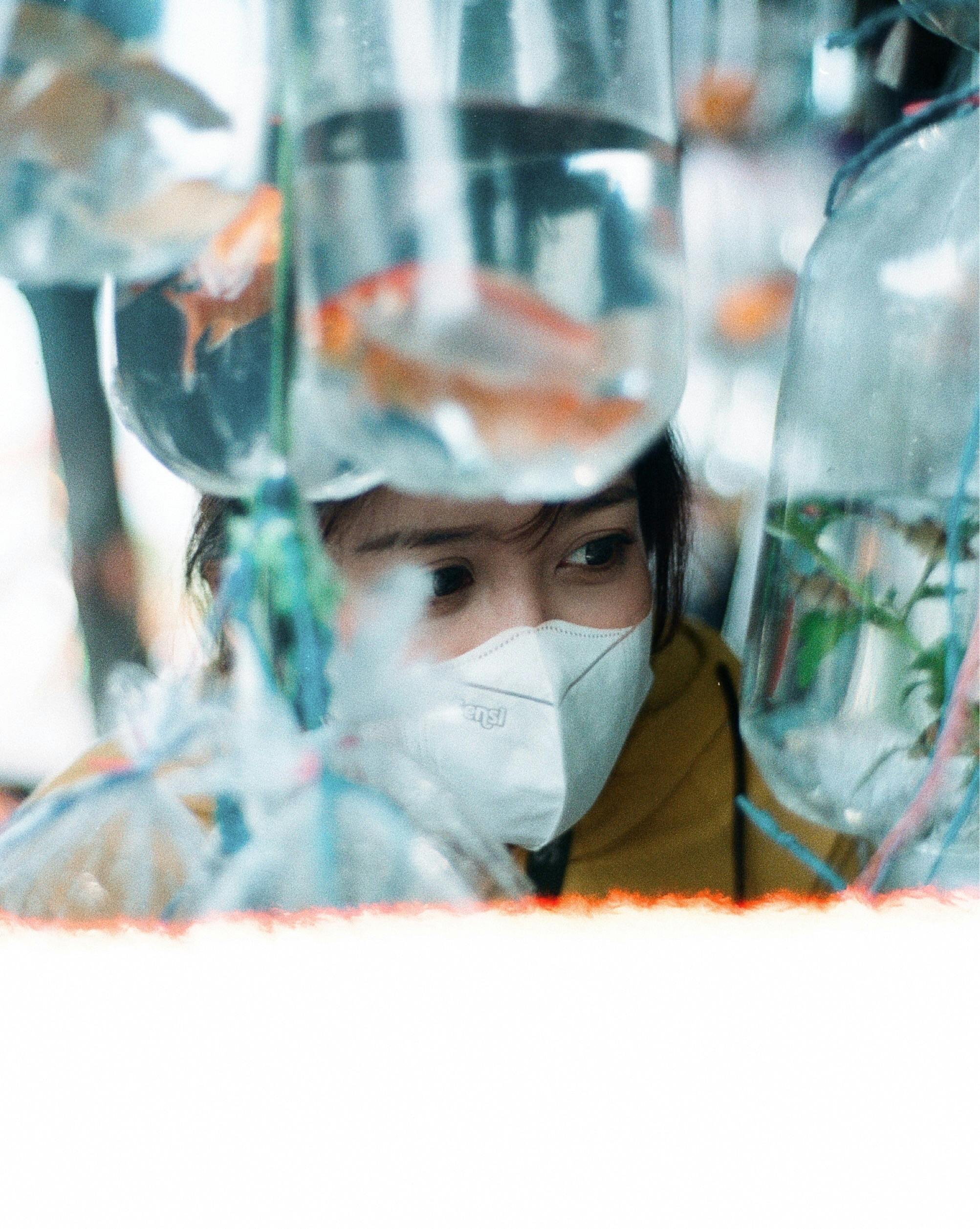 Close-Up Shot of a Woman Wearing a Denim Jacket · Free Stock Photo
