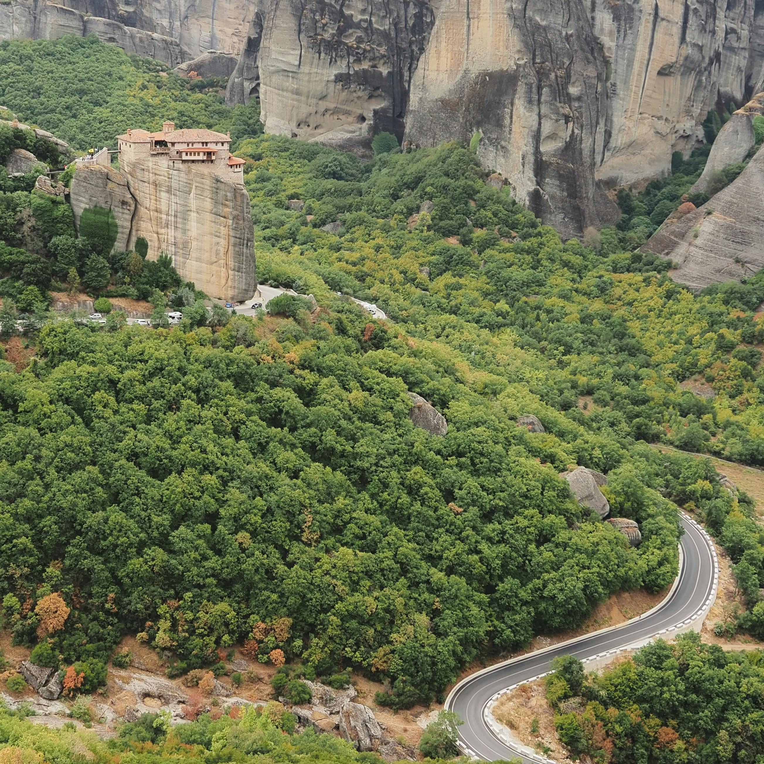 House on Rock Formation over Forest and Road · Free Stock Photo
