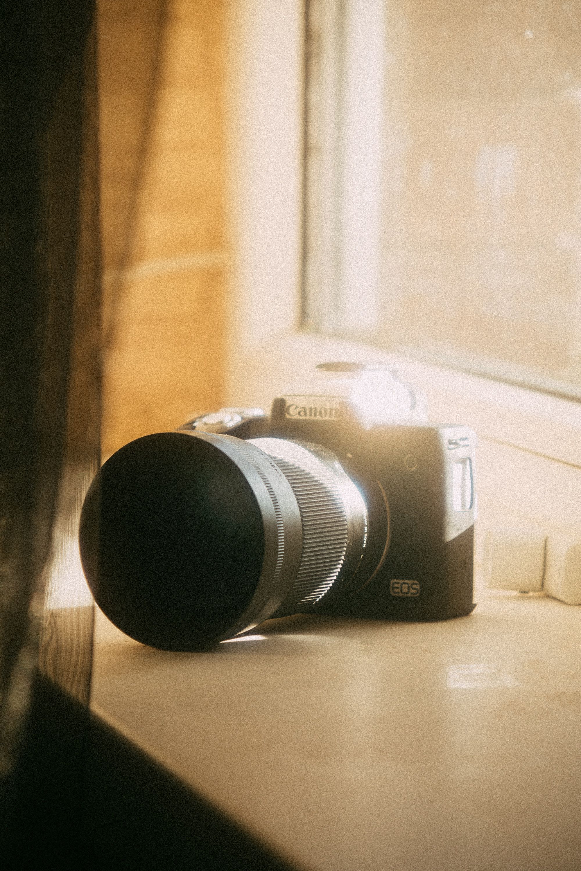 Black Sony Dslr Camera Beside Brown Notebook · Free Stock Photo