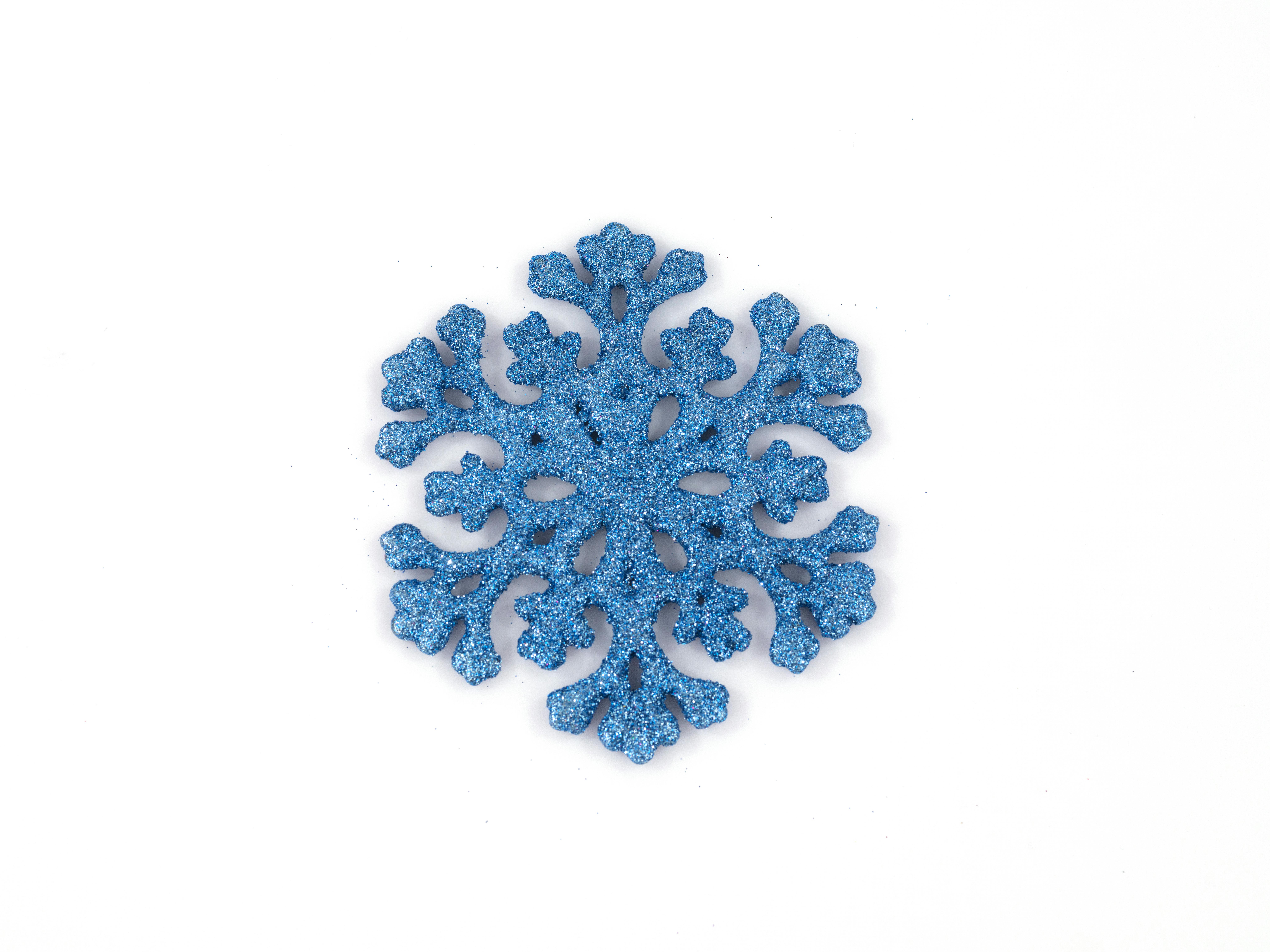 Close-up Photo of Sparkling Blue Snowflake · Free Stock Photo